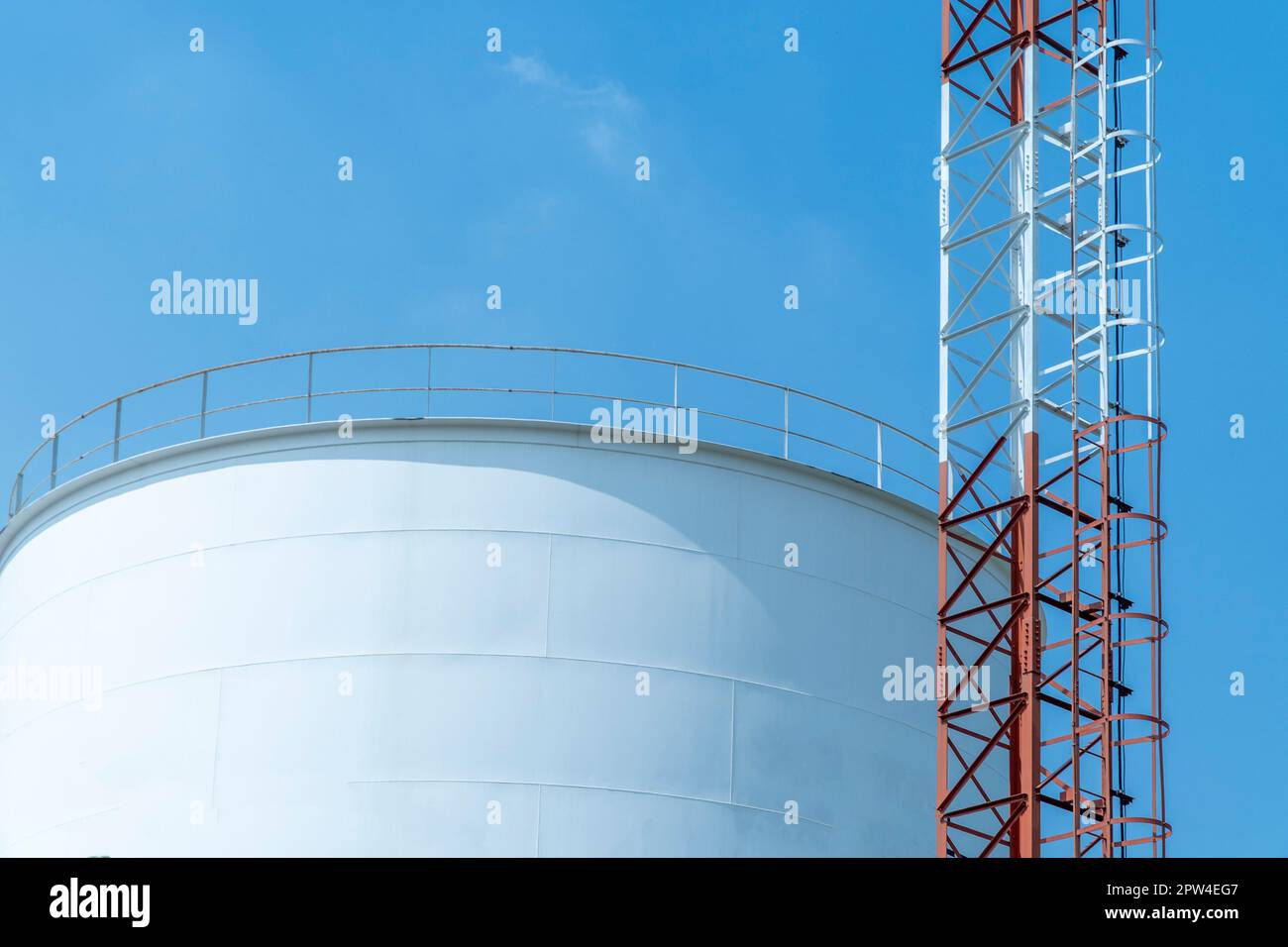Large white water tank with blue sky Stock Photo - Alamy