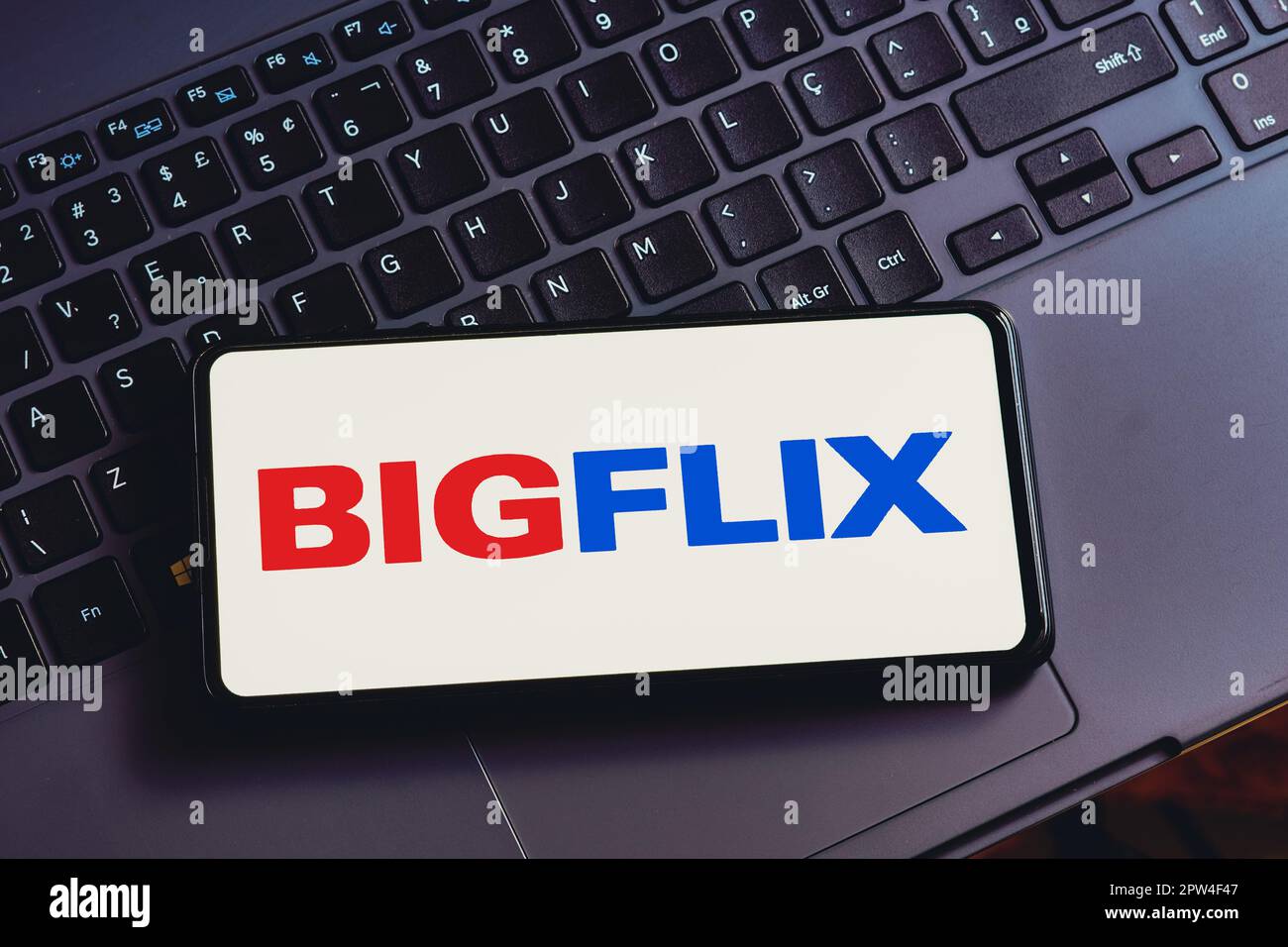In this photo illustration, the BIGFlix logo is displayed on a smartphone screen Stock Photo - Alamy