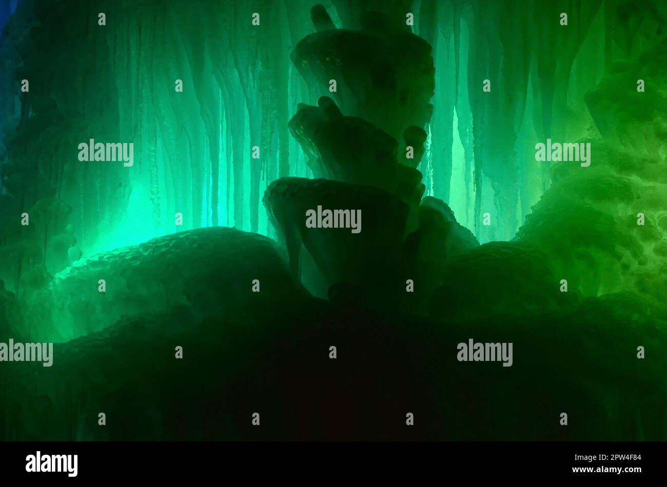 Huge ice icicles. Fragment of large blocks of ice frozen waterfall of ...