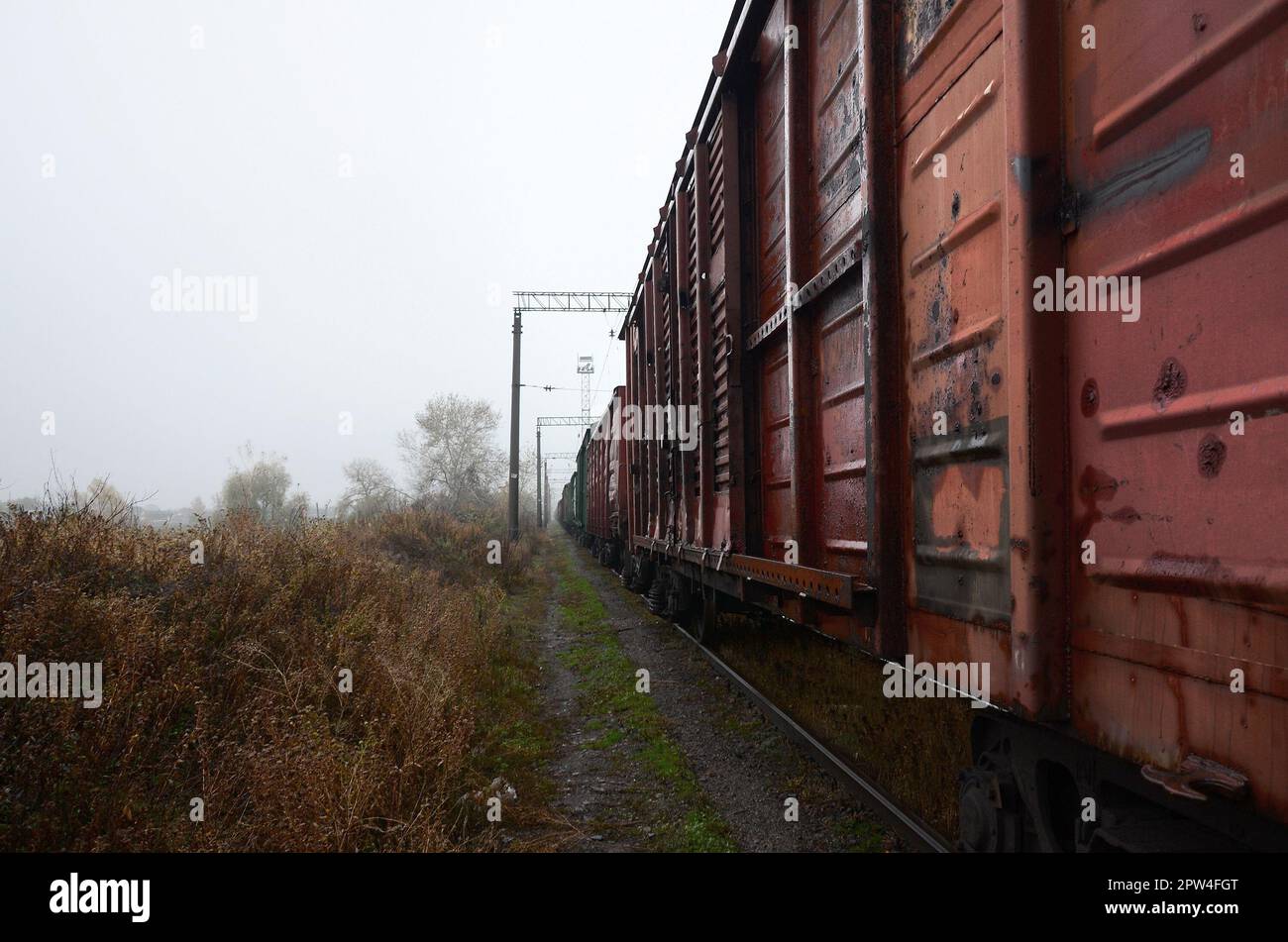 Photo of the train on rainy cloudy weather with shallow depth of field ...