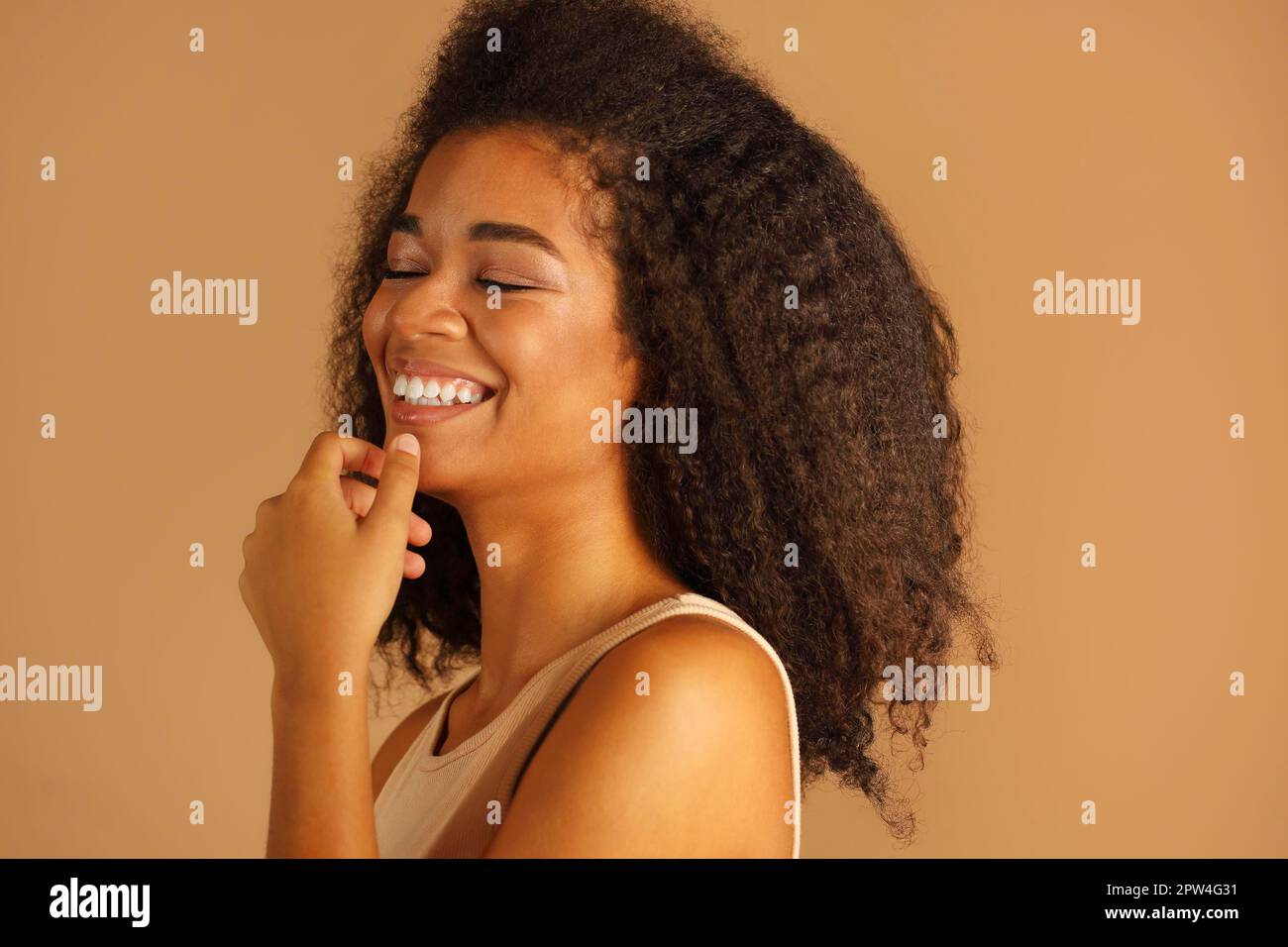 Portrait in profile of joyful dark skinned model with closed eyes ...