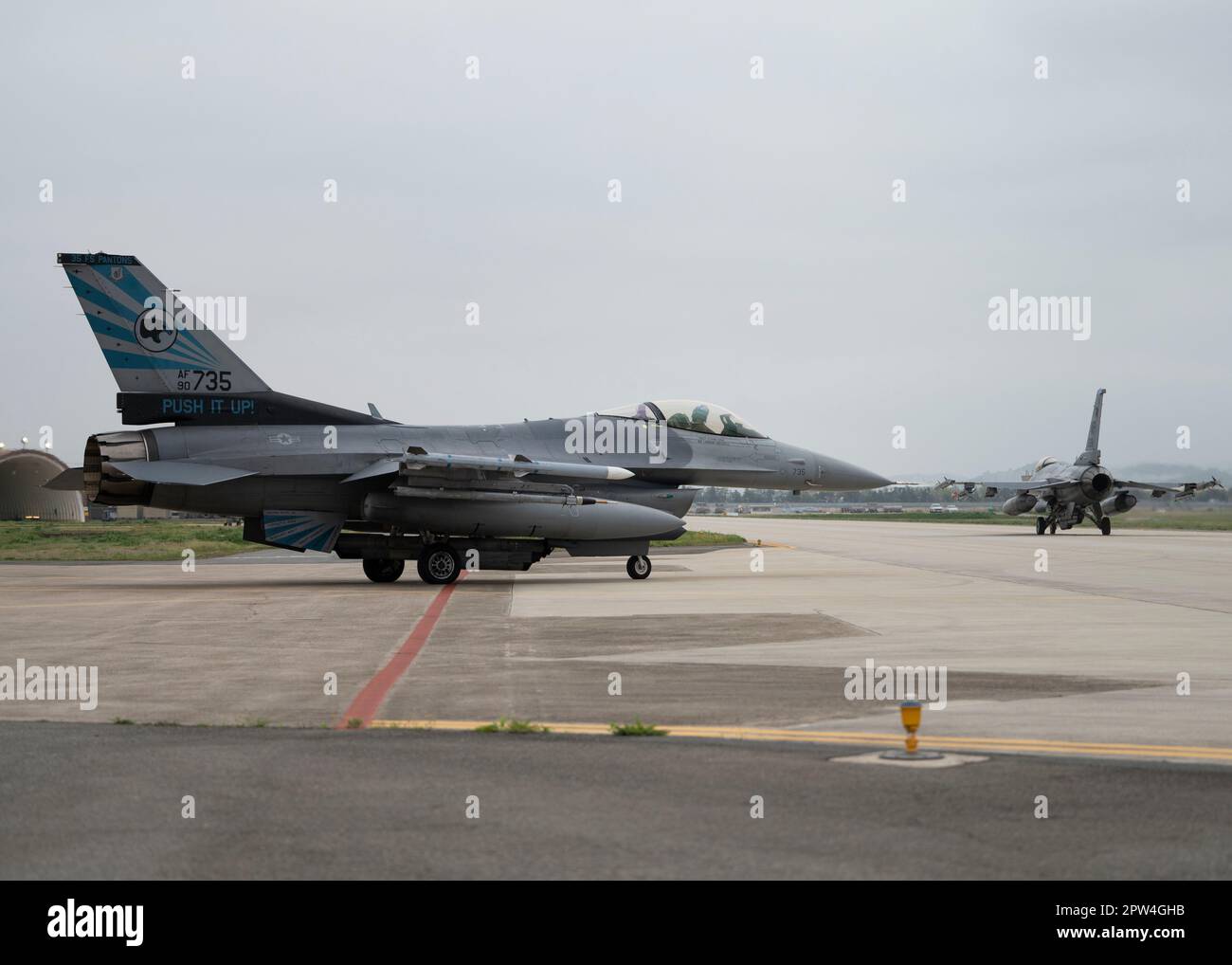 Two F-16 Fighting Falcons assigned to the 8th Fighter Wing, Kunsan Air ...