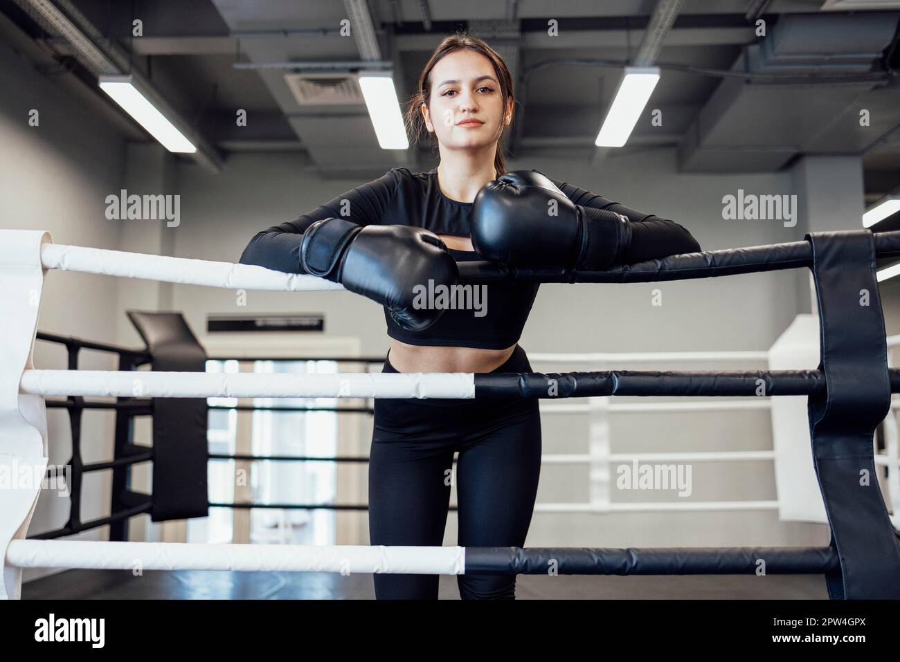 Strong latin boxing woman on the ring at fitness gym. Athletic girl ...