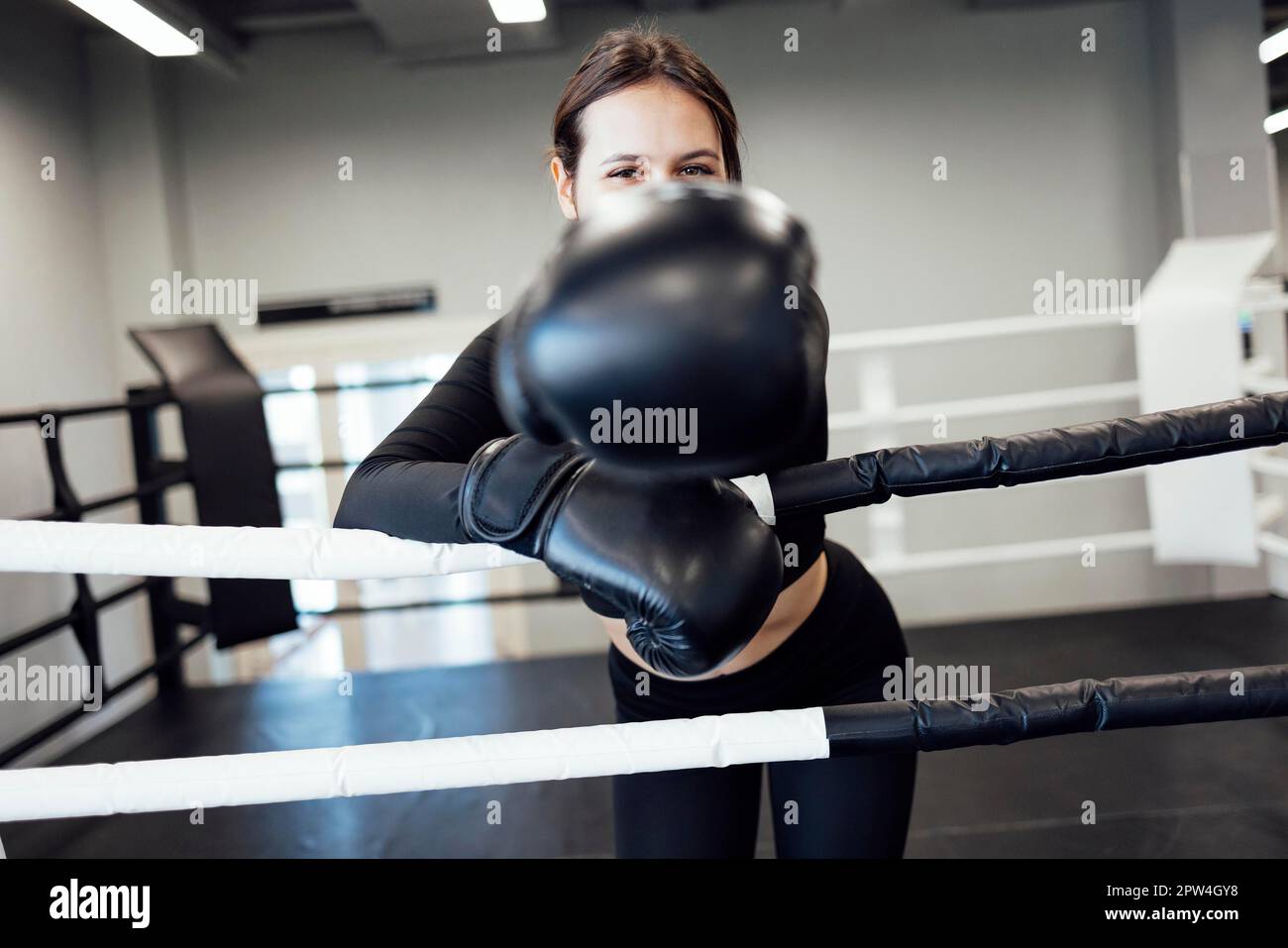 Strong latin boxing woman on the ring at fitness gym. Athletic girl ...