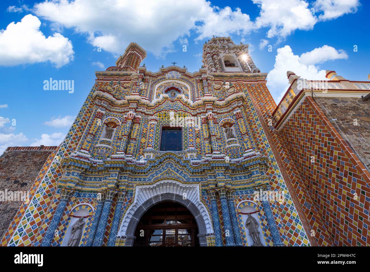 Church of Francisco Acatepec and colorful colonial architecture of ...