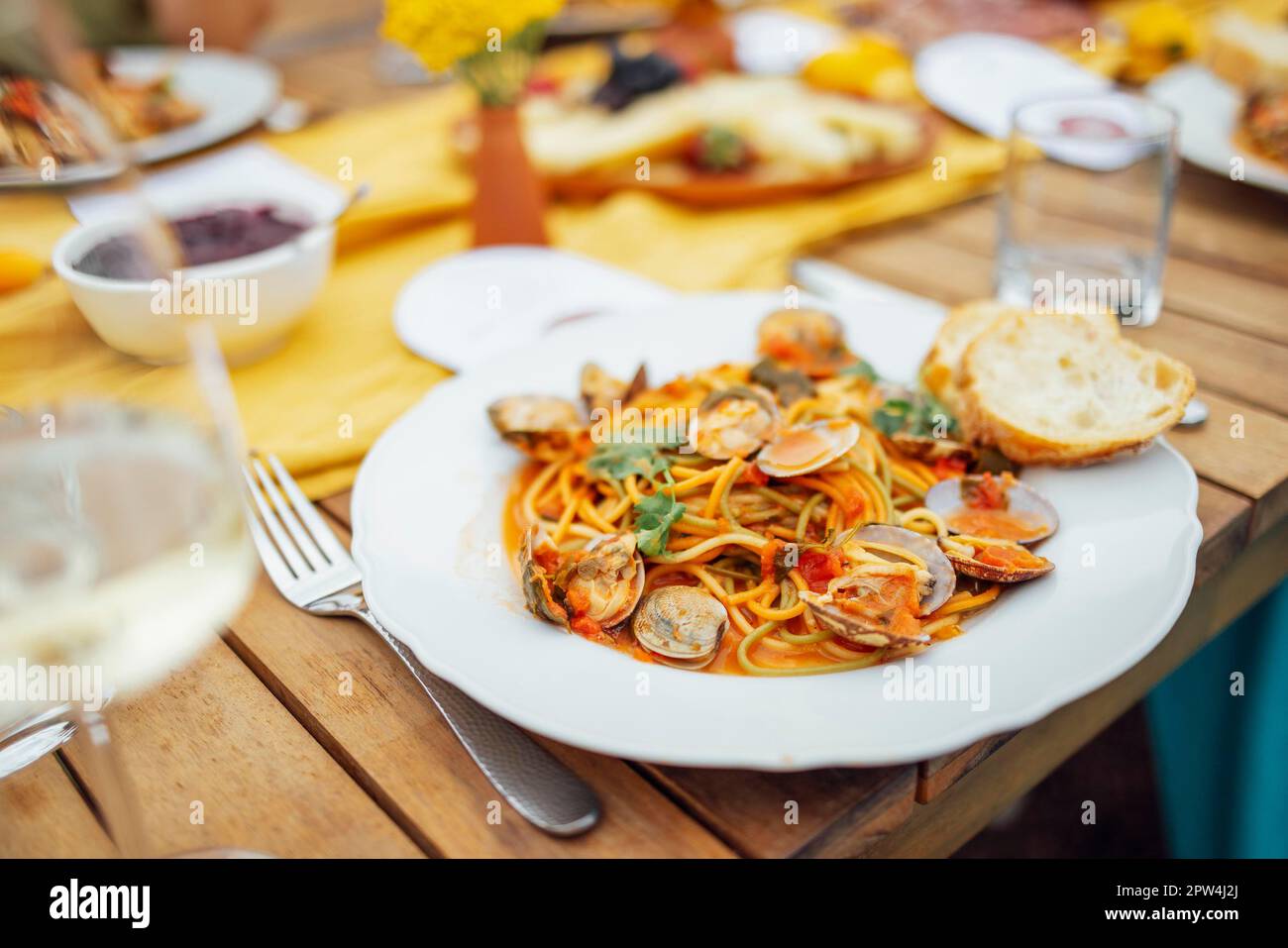 Seafood Spaghetti with seashells, prawns, squids on table background ...