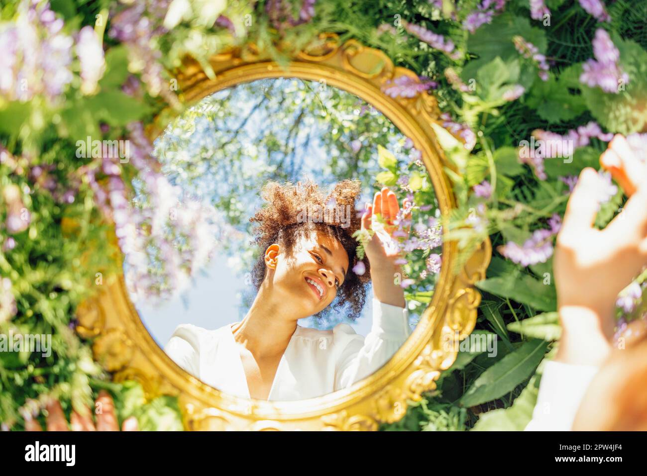 Beautifal Mixed-race woman wearing white dress and sky reflection in ...