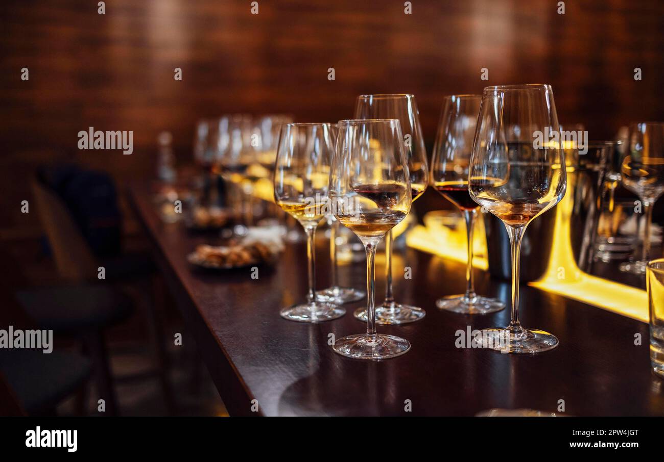 Glass goblets placed in rows on table during wine tasting procedure in ...