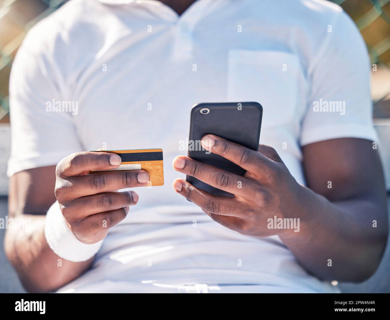 Black man transaction mobile phone hi-res stock photography and images ...