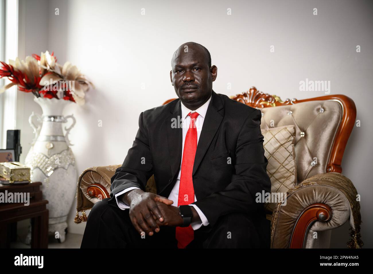South Sudanese refugee Emmanuel Kondok poses for a photograph at his ...