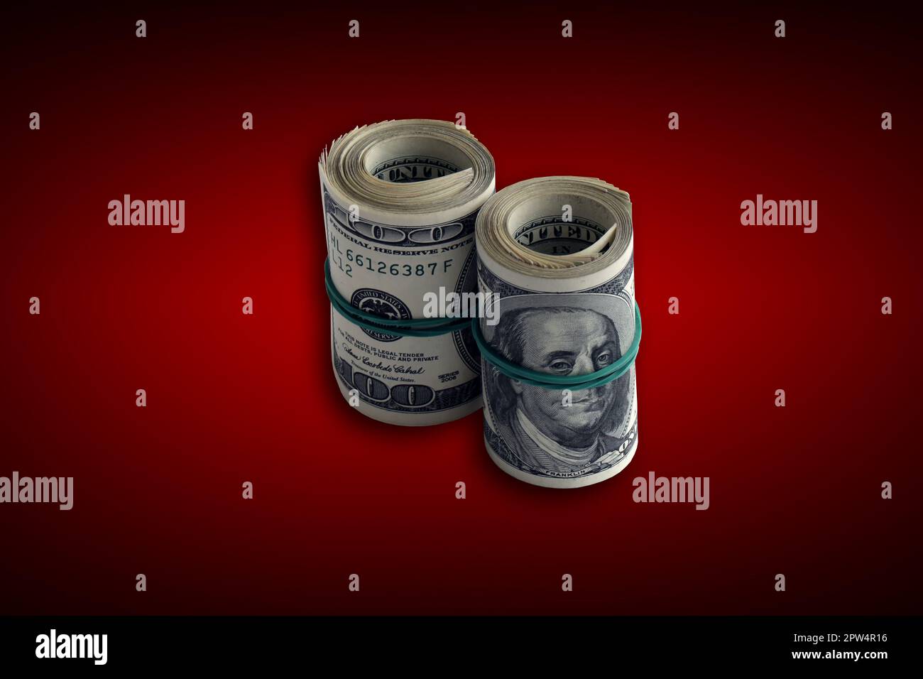 Bundle of US dollar bills on crimson red background. Pack of american ...