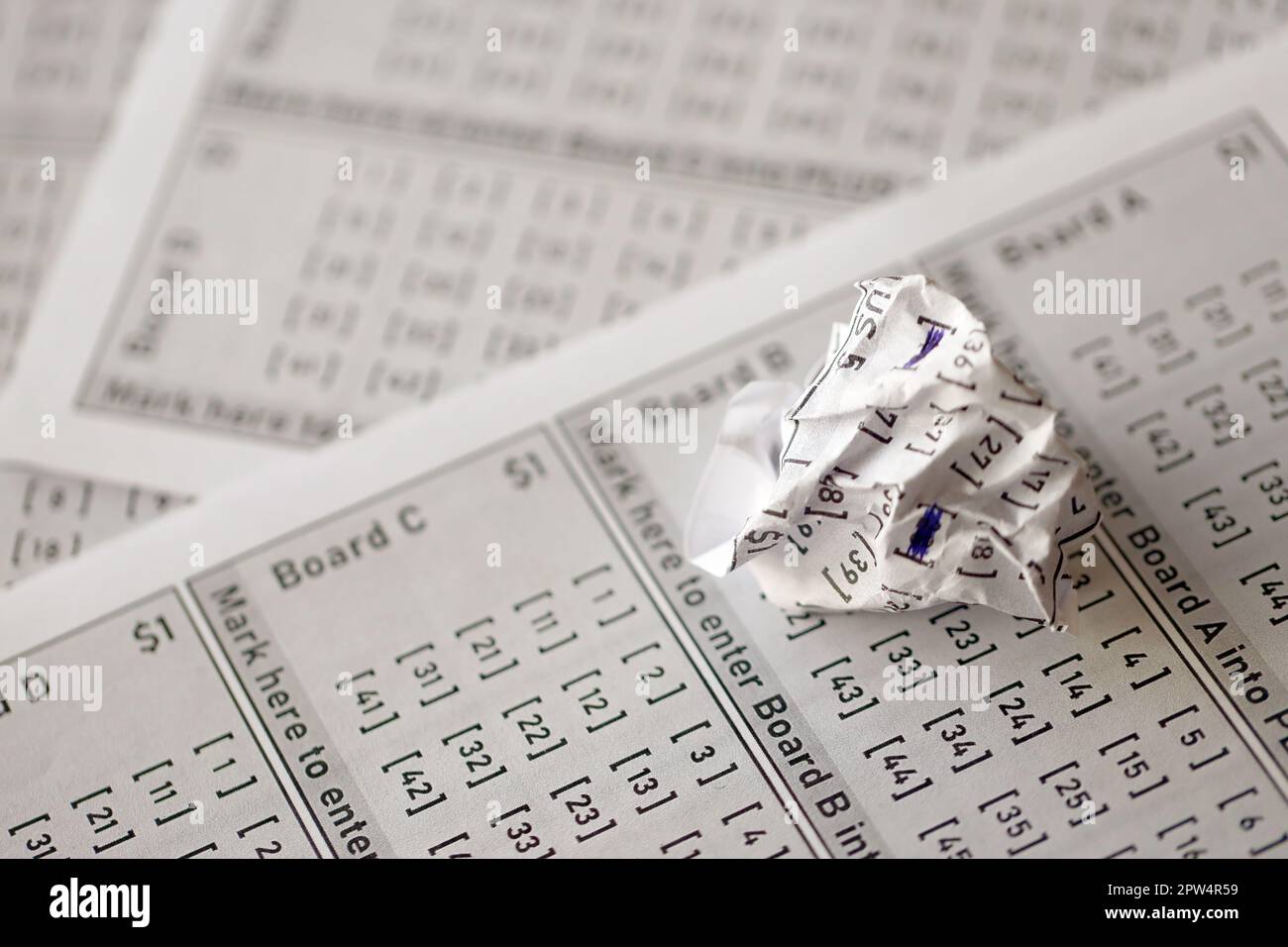 Crumpled lottery tickets as symbol of losing the lottery game. Unlucky ...