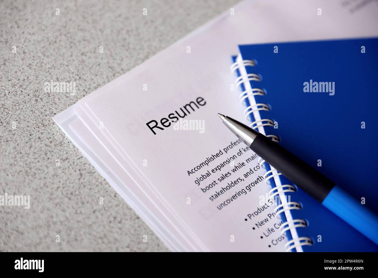 Top view of stack of office documents including resume and cv forms on ...