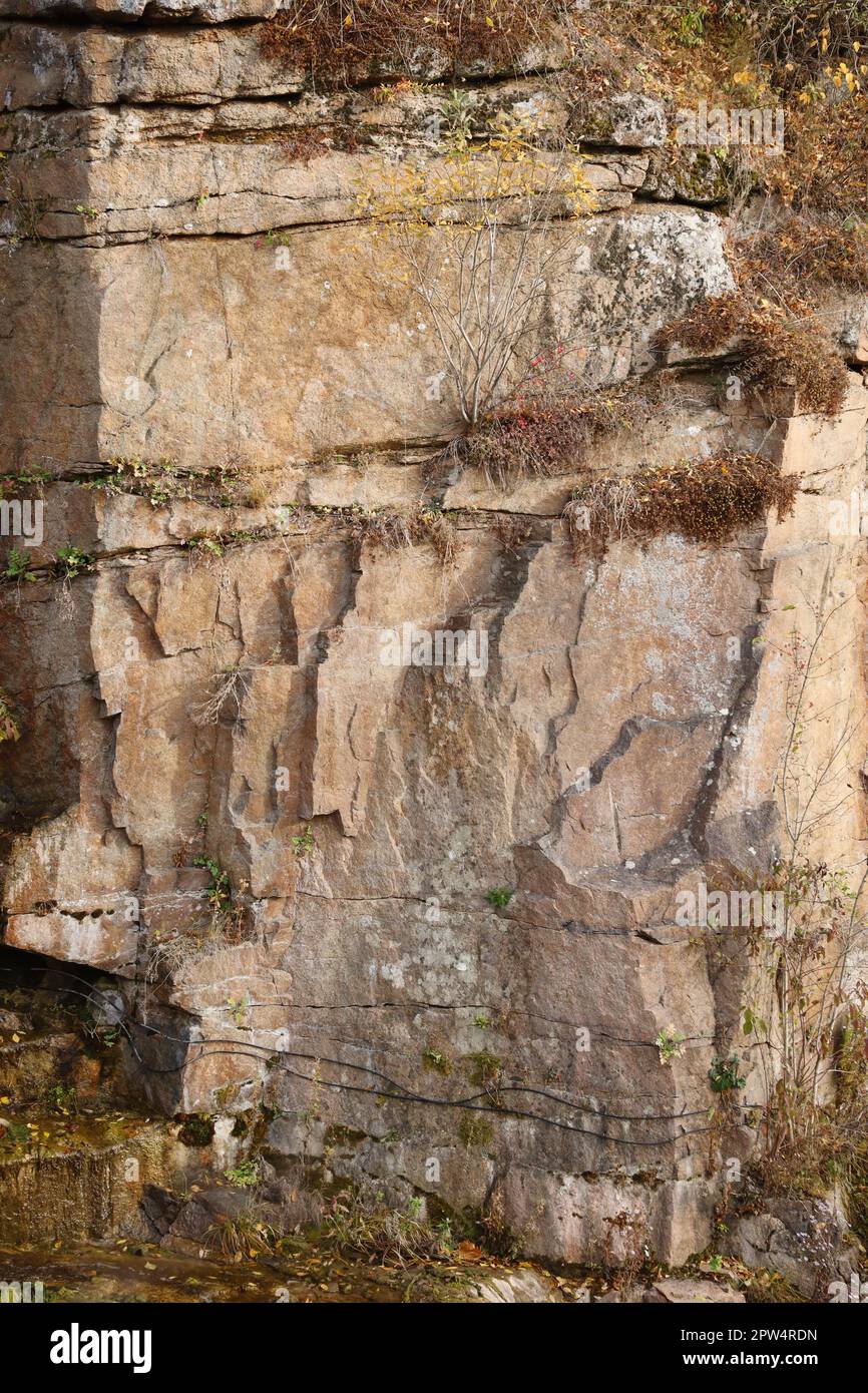 Light coarse natural rock stone background. Mining cliff rough front ...