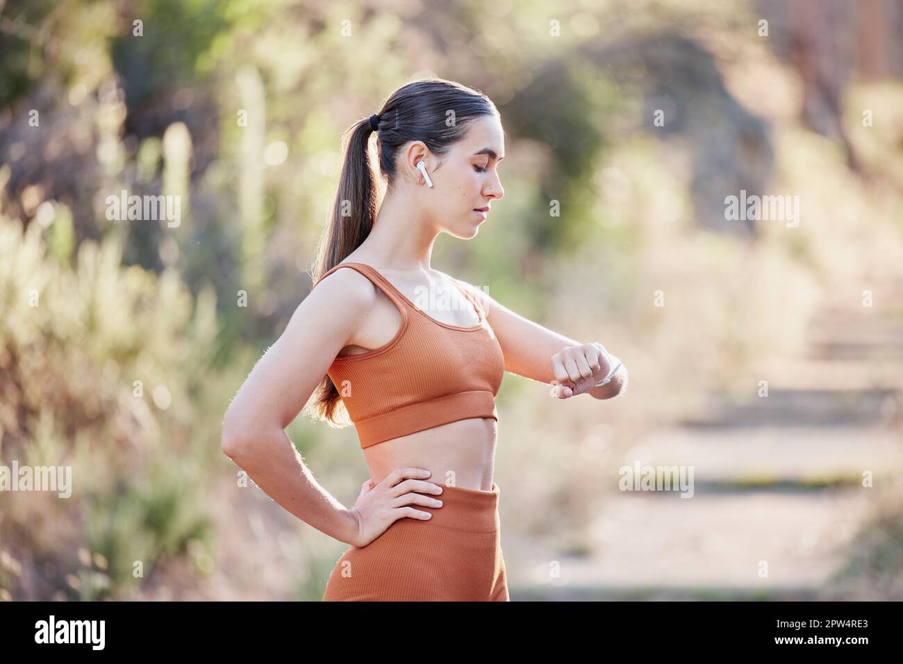 Fitness, woman and smart watch time for running, park exercise workout ...