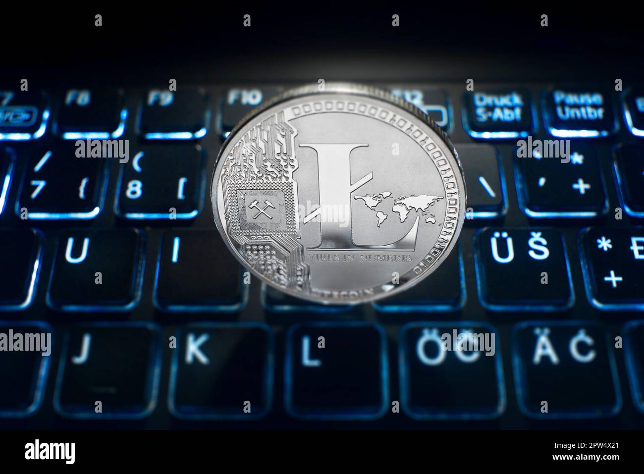 Litecoin on computer trading background. Virtual cryptocurrency concept ...