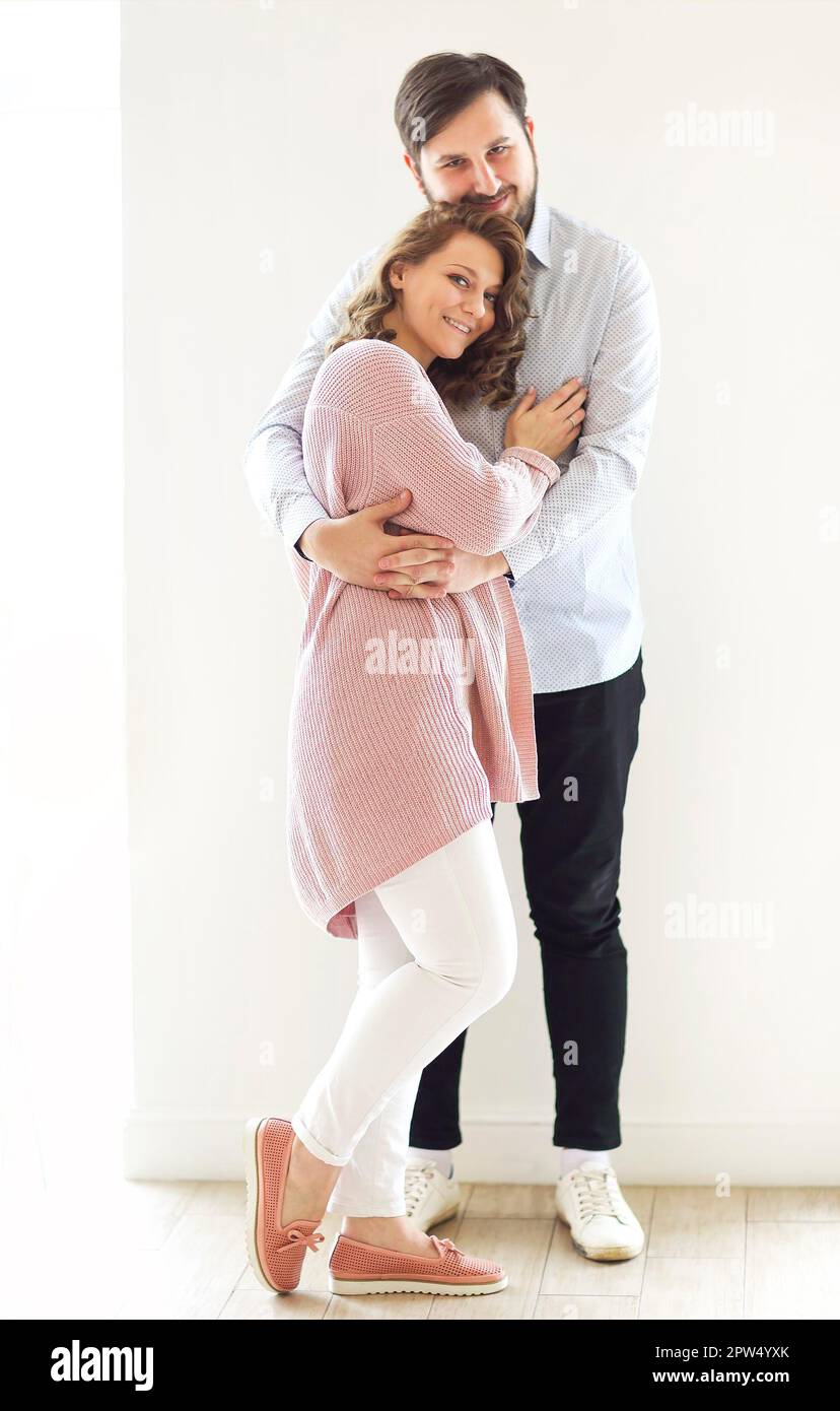 Couple cuddle home hi-res stock photography and images - Alamy