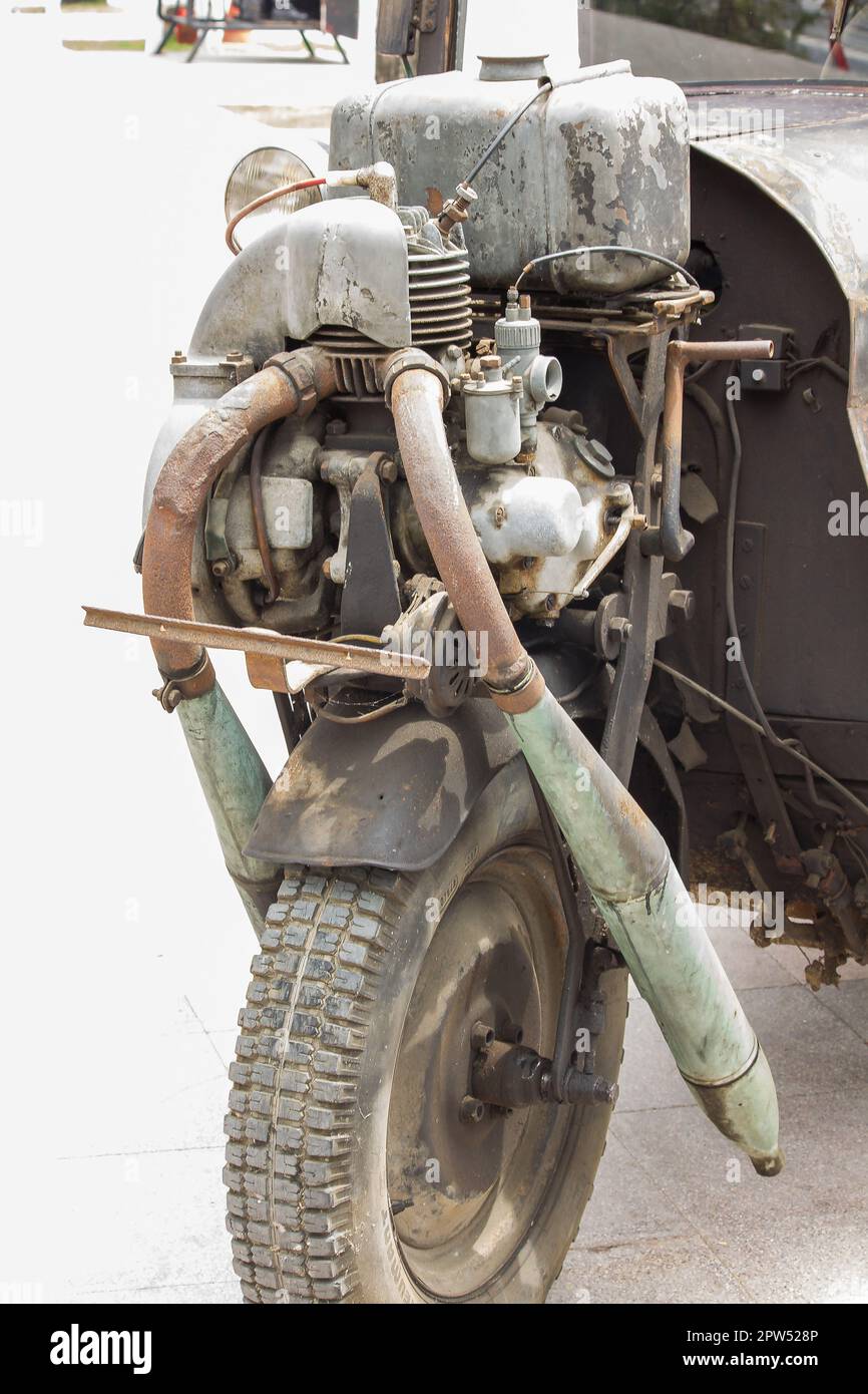 Vintage car engine on the front wheel. for many years Stock Photo - Alamy