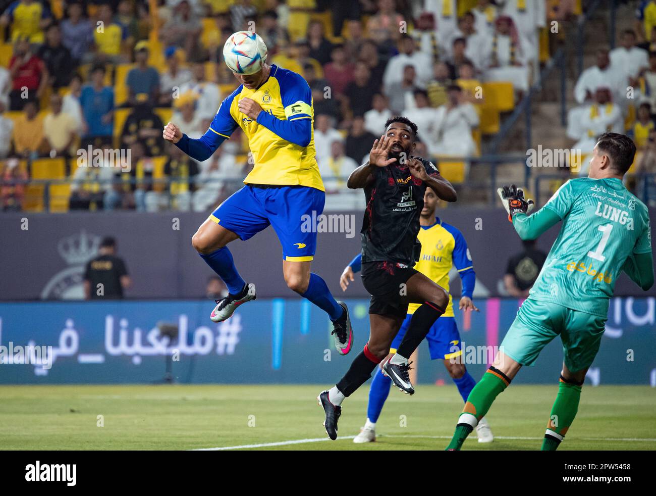 Cristiano Ronaldo of Al-Nassr FC scores against Al-Raed FC during their ...