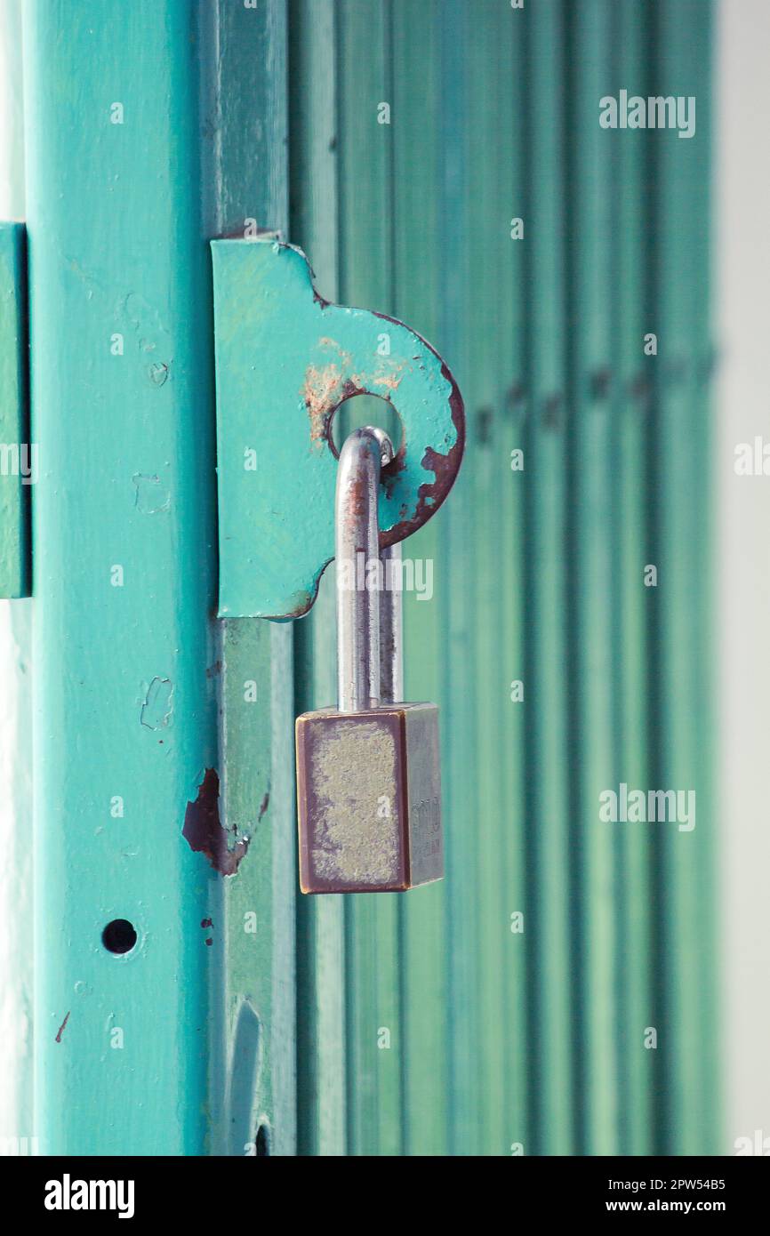 The lock key is on the steel door loop Stock Photo - Alamy
