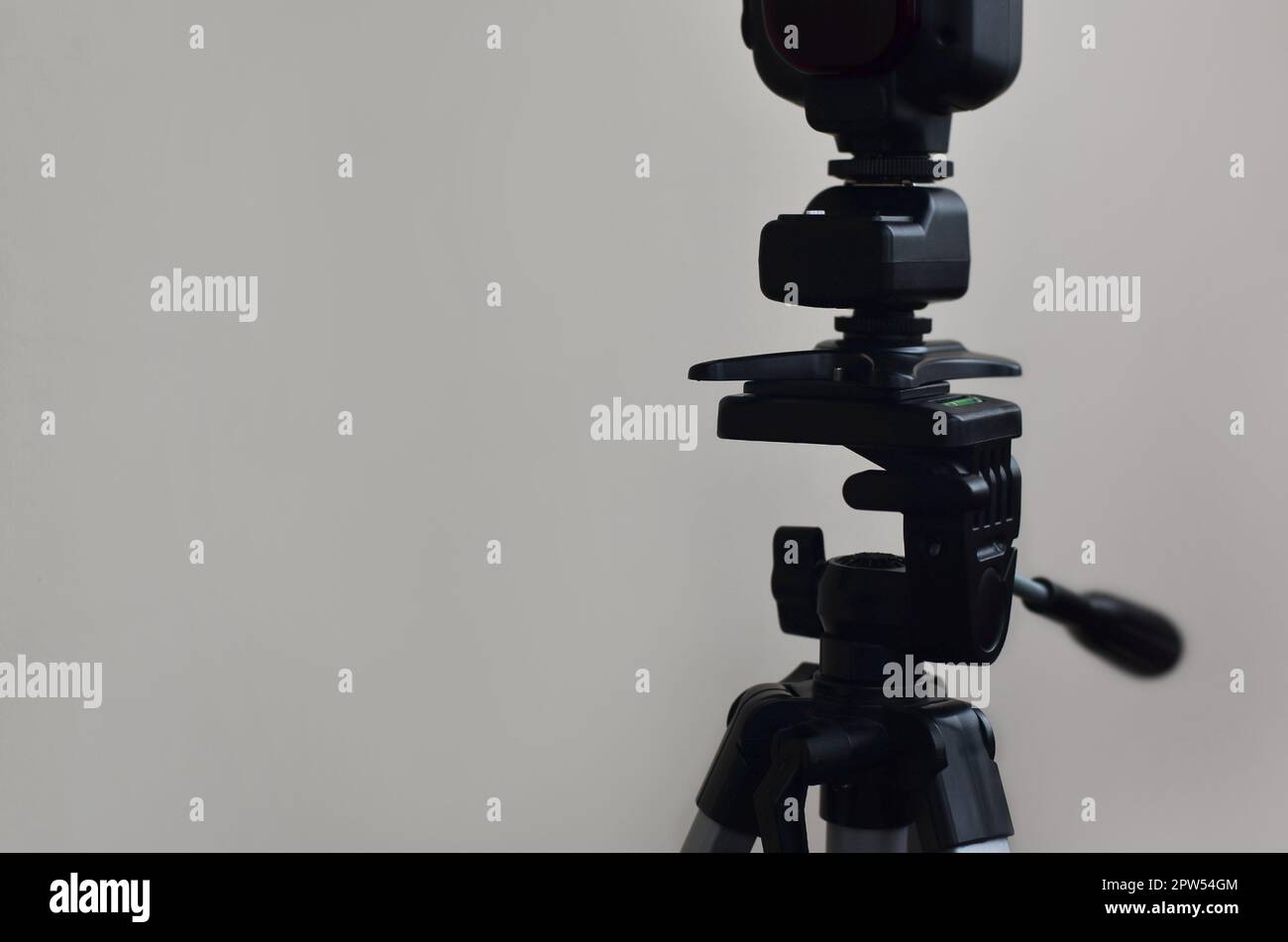 External Photographic Flash Is Mounted On The Synchronizer Which Stands On A Tripod Lighting