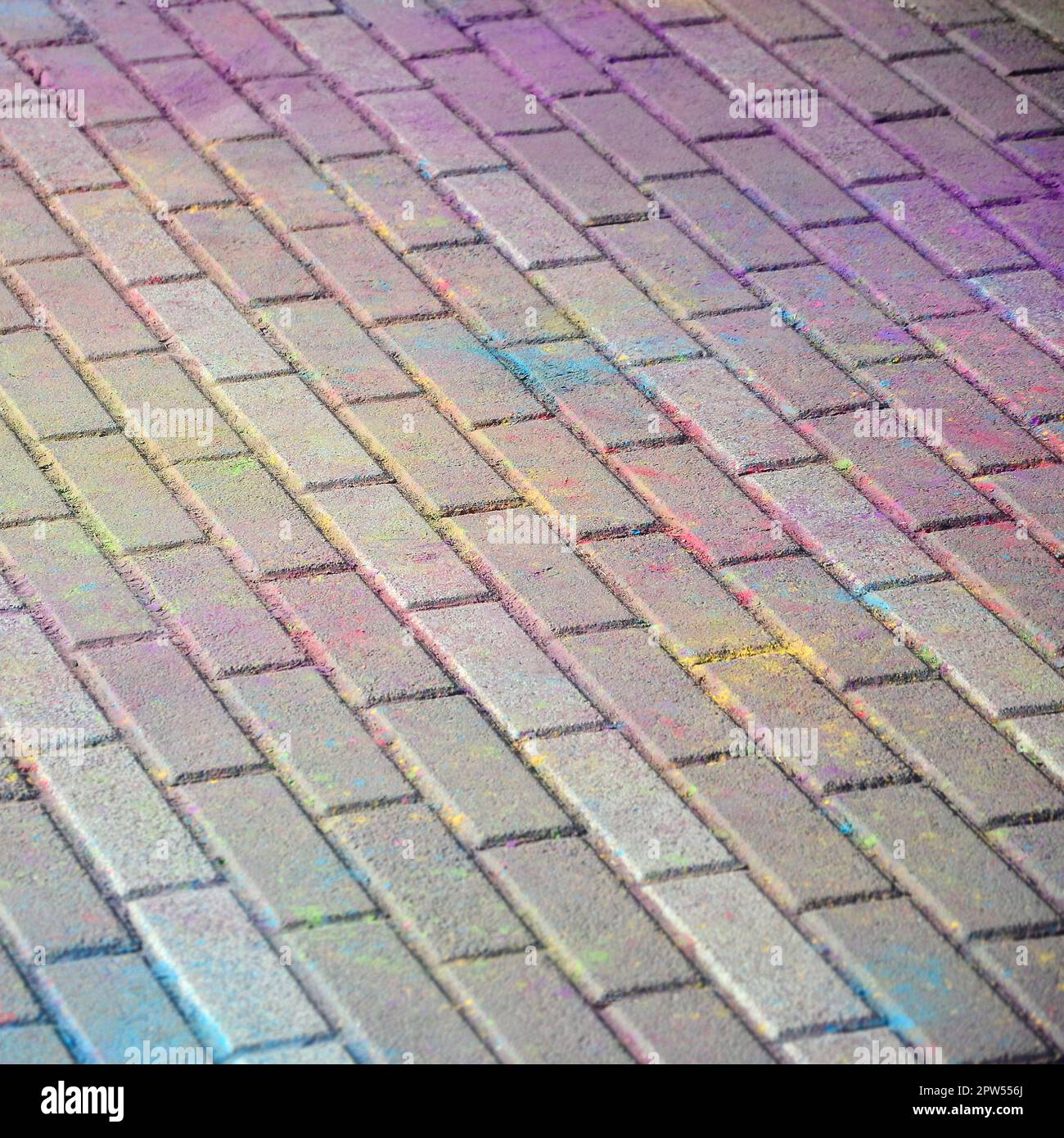 Multi colored earth, paving slabs, powder coated with dry colors at the ...