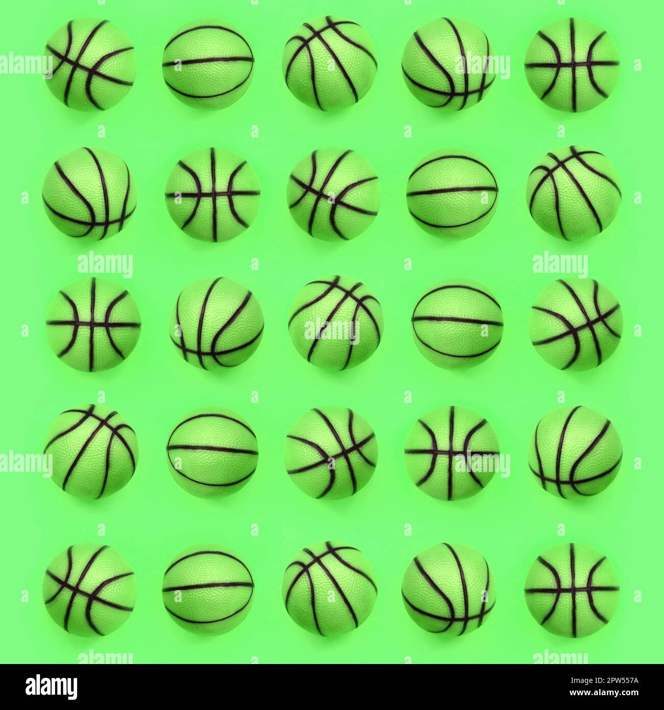 Many small green balls for basketball sport game lies on texture ...