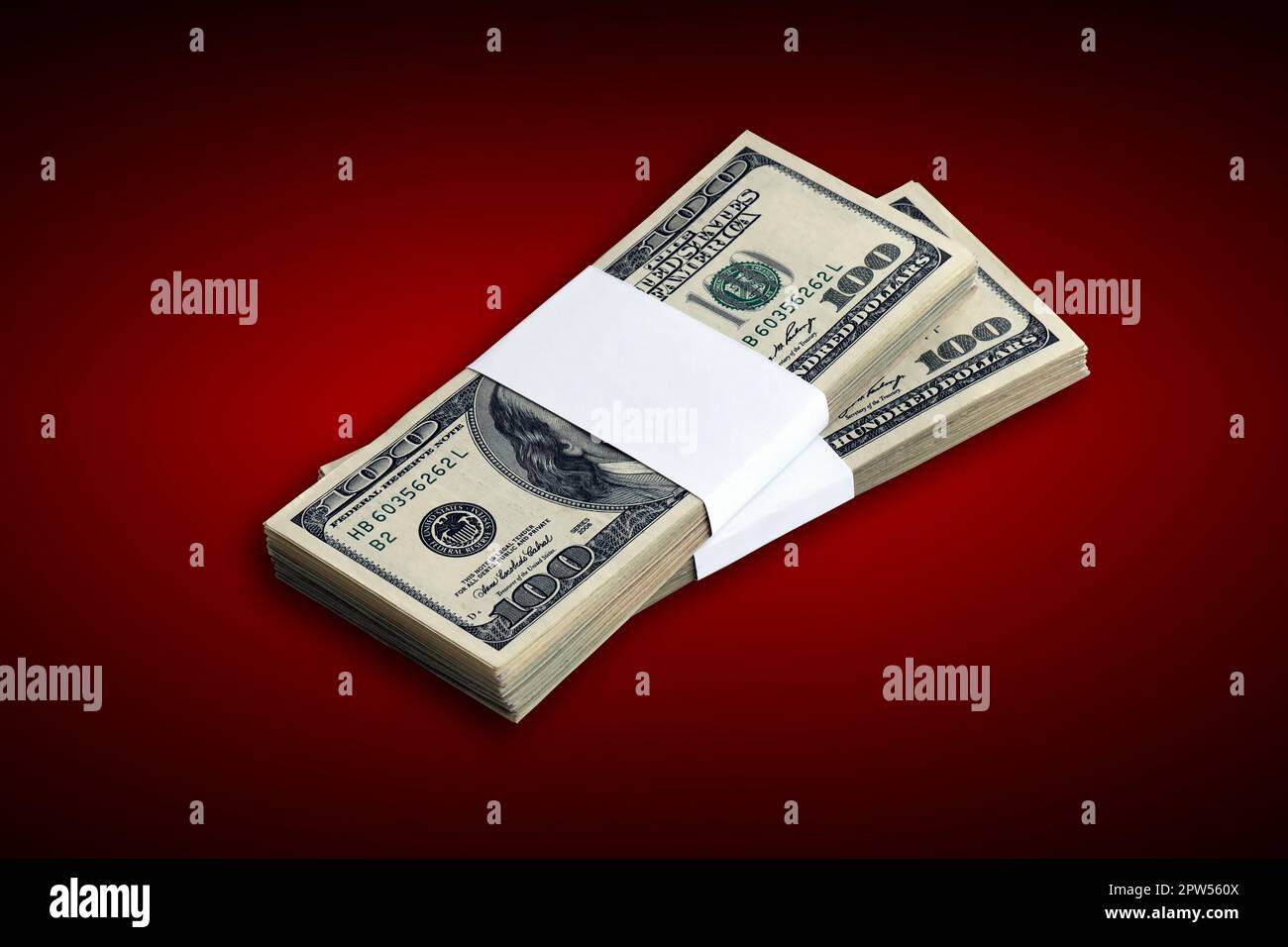 Bundle of US dollar bills on crimson red background. Pack of american ...