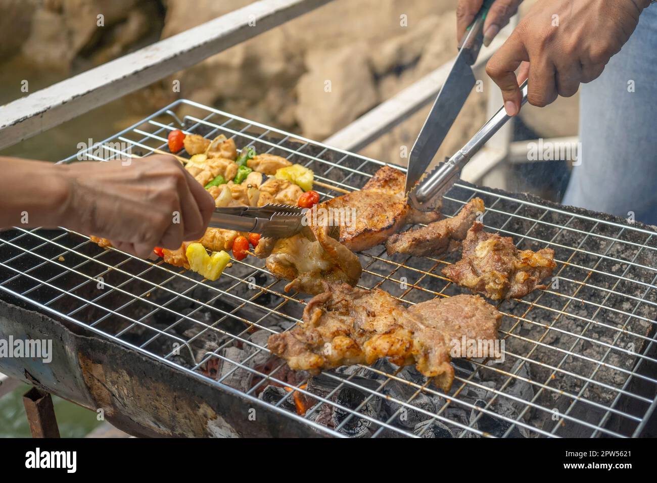 Burning meat on the grill cookout steak Stock Photo - Alamy