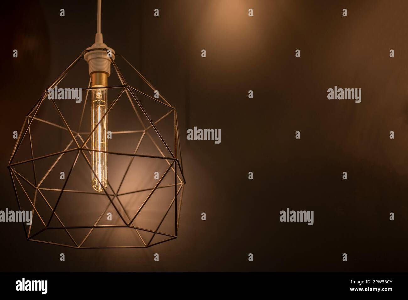 Golden desk lamp light modern copper background Stock Photo - Alamy