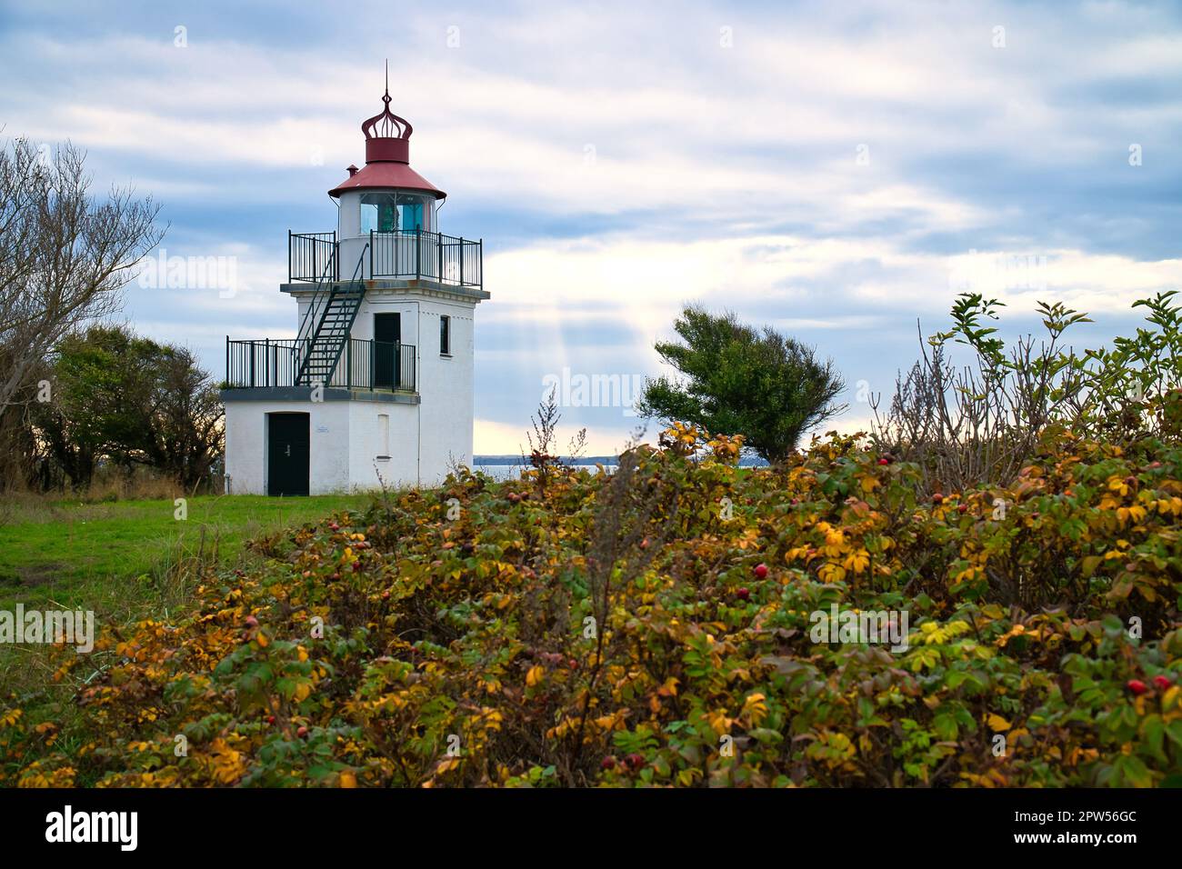 Lighthouse, Spodsbjerg Fyr in Huntsted on the coast of Denmark. Sun ...