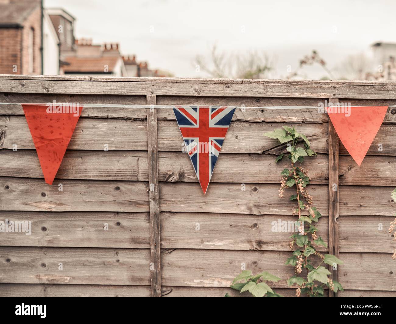 Flags of Great Britain waving on the wind in the garden of English ...