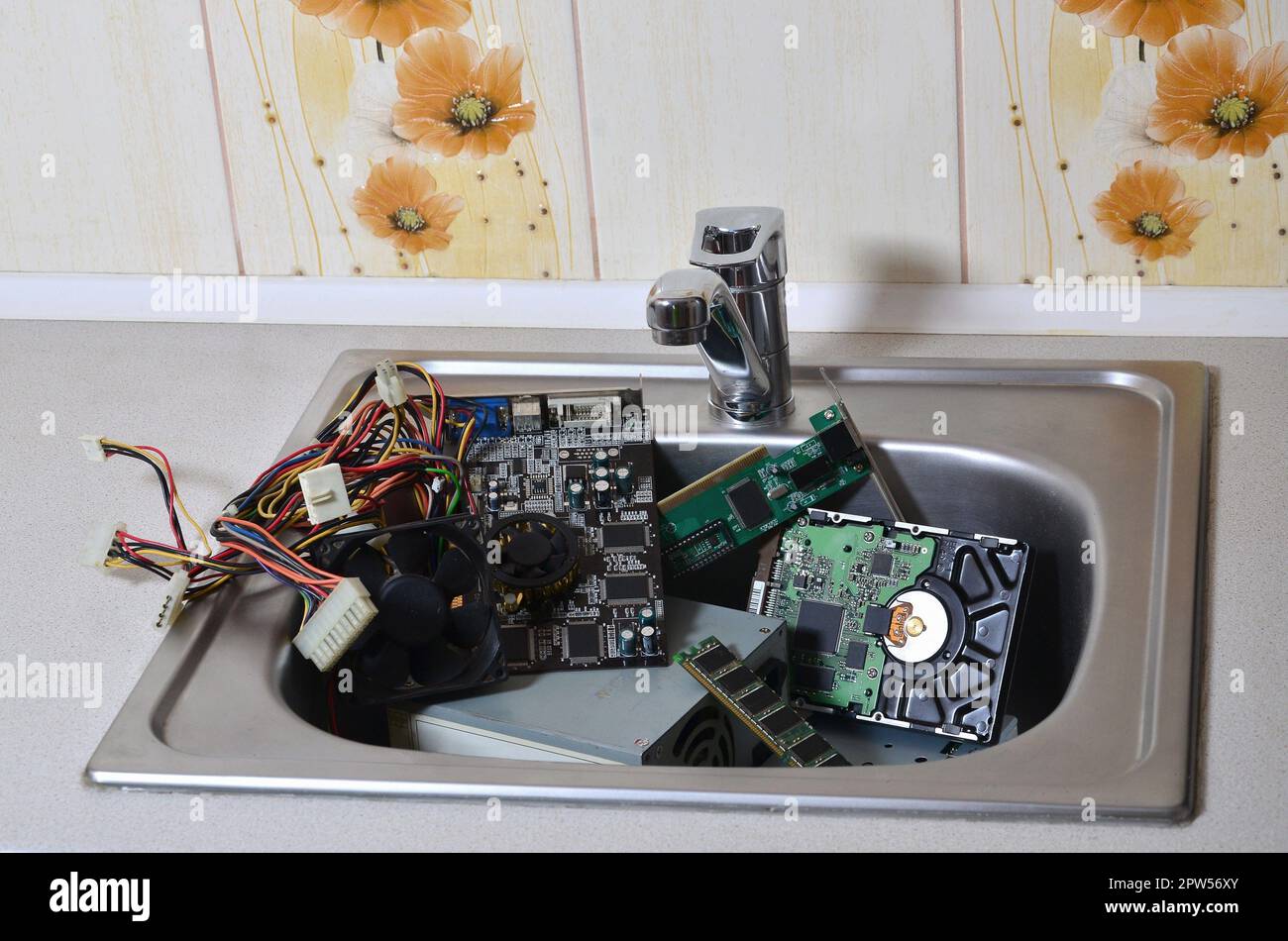 Personal computer cleaning metaphoric concept. Hardware in kitchen sink ...