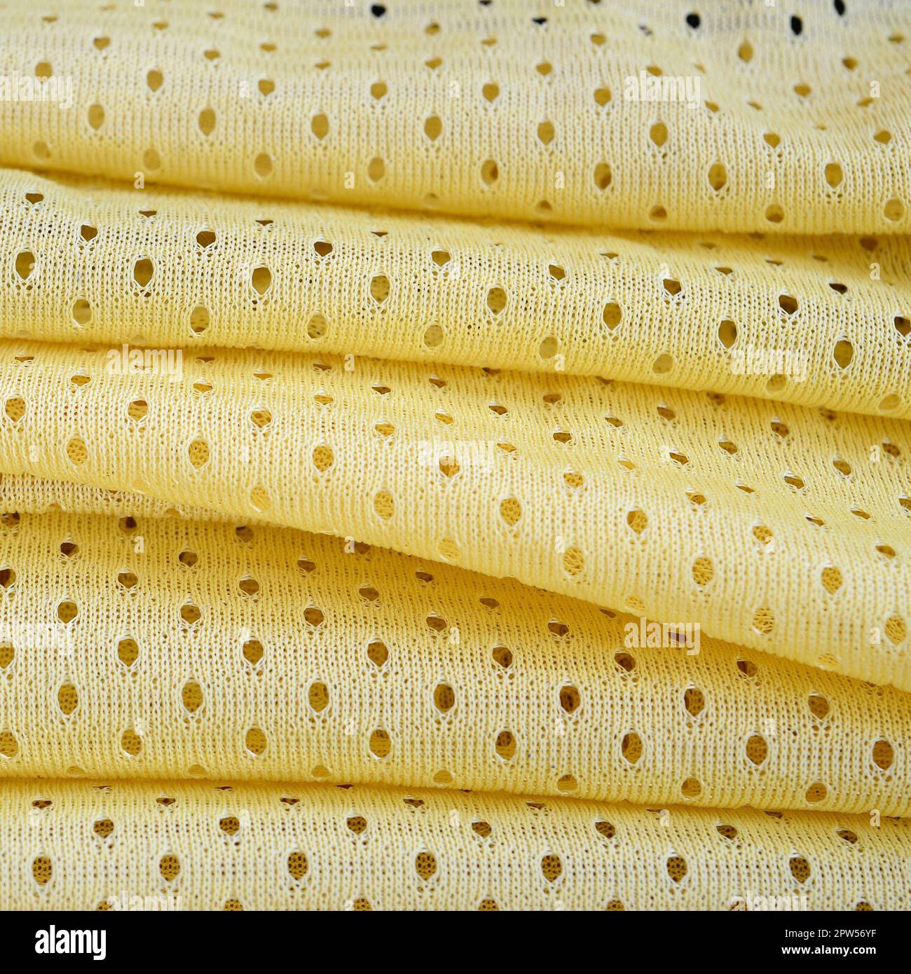 Yellow mesh sport wear fabric textile pattern background. Yellow color ...