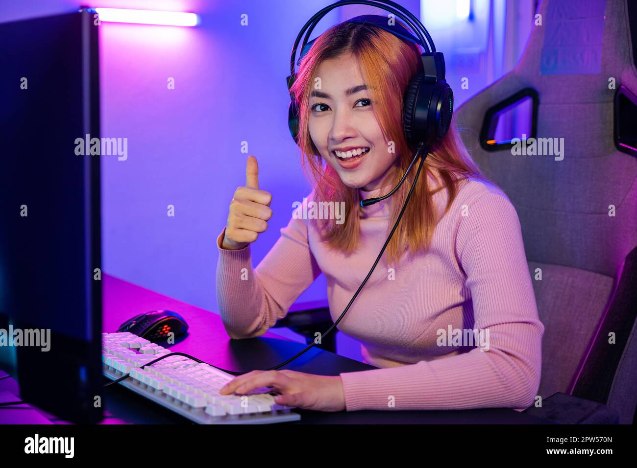 Gamer playing online game wear gaming headphones looking to camera ...