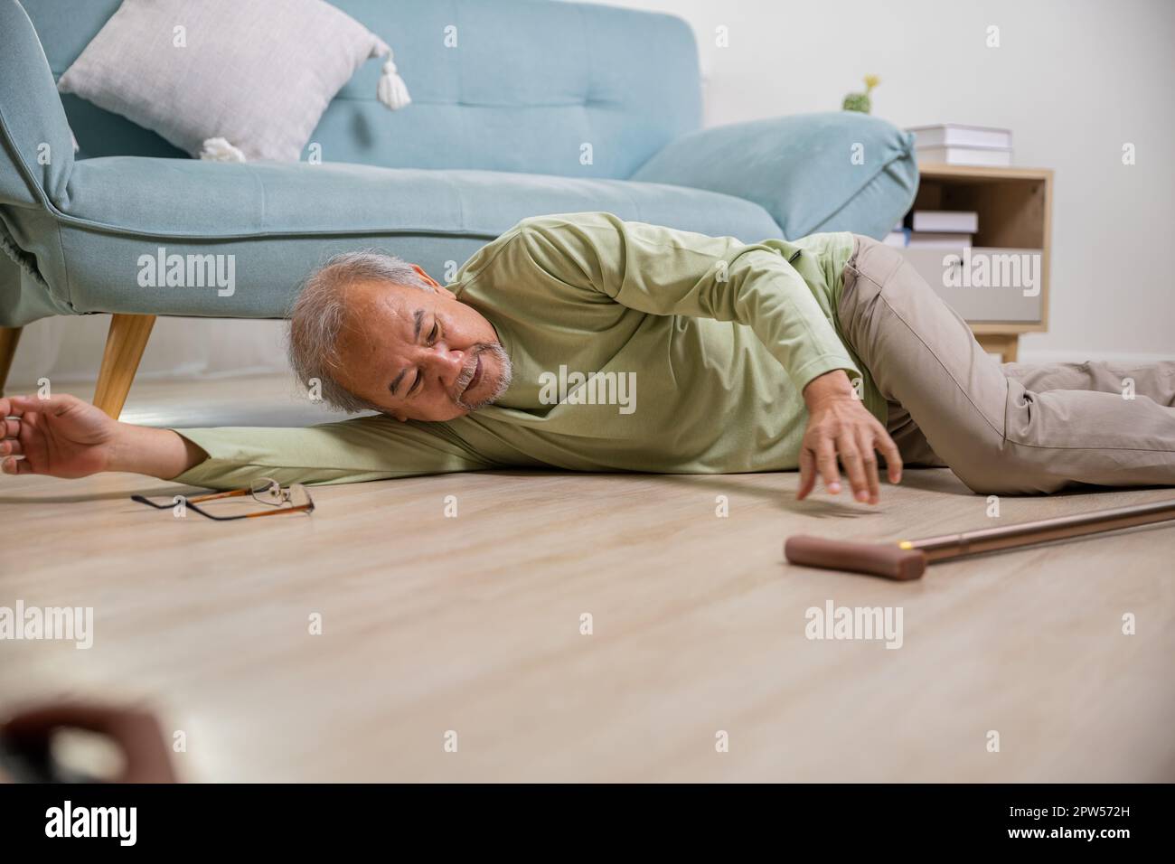 Senior man on couch with walker hi-res stock photography and images - Alamy