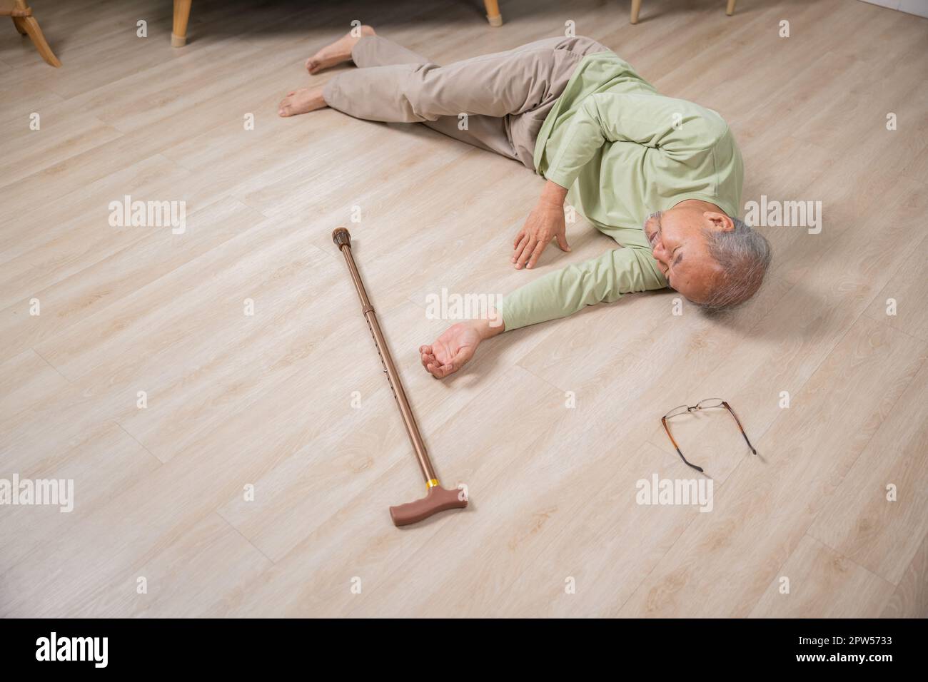 Sick senior old man falling down lying on the ground because stumbled ...