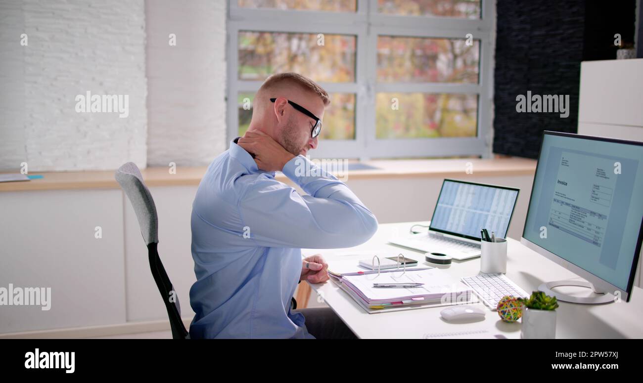 Posture Fatigue Shoulder Pain. Mature Man At Computer Workstation Stock ...