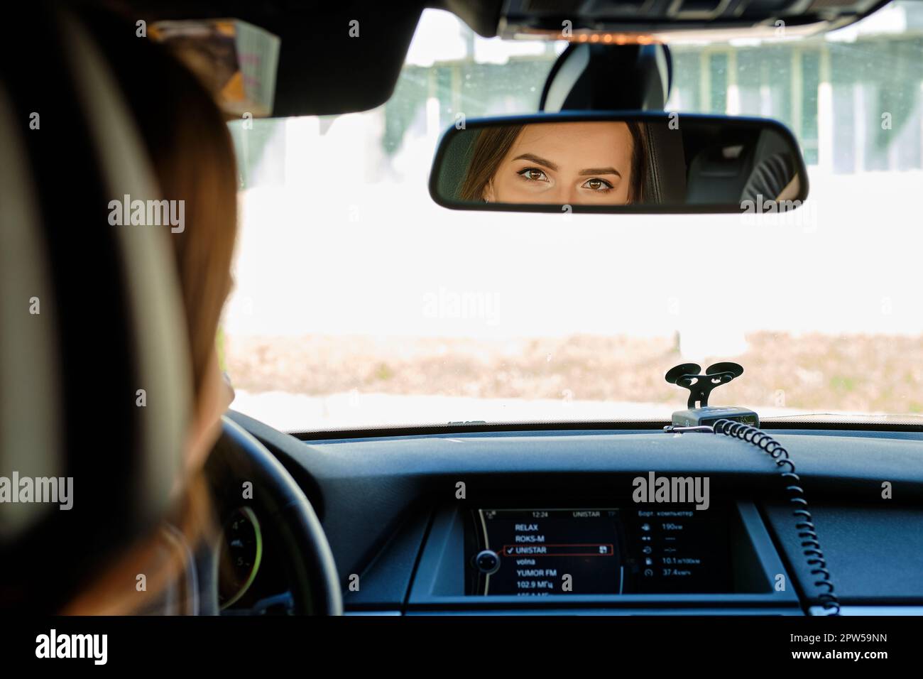 Reflection of female eyes in rearview mirror of a car Stock Photo - Alamy