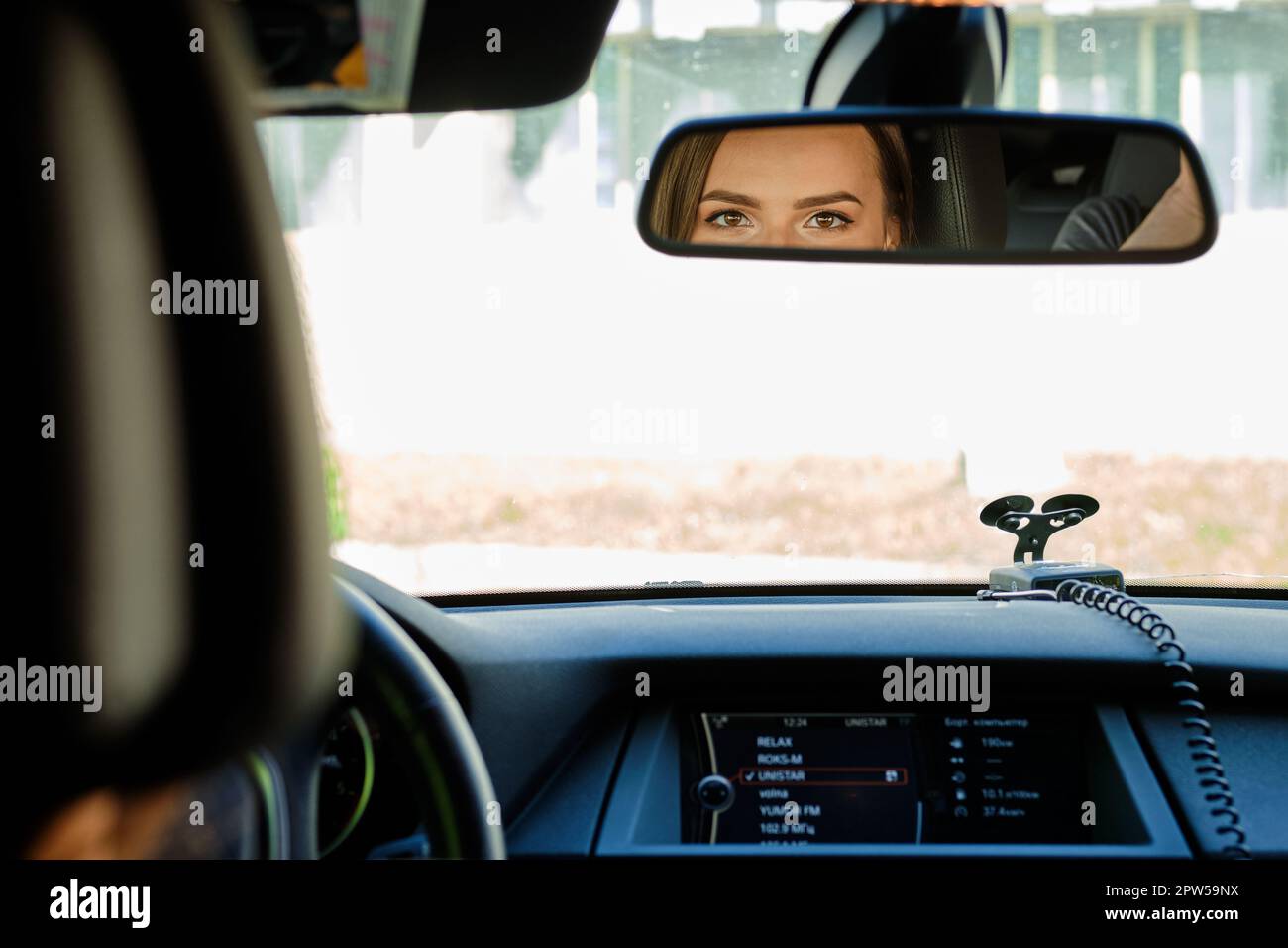 Reflection of female eyes in rearview mirror of a car Stock Photo - Alamy