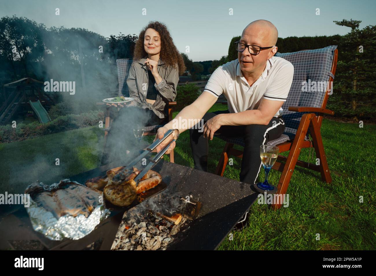 Evening barbecuing hi-res stock photography and images - Alamy