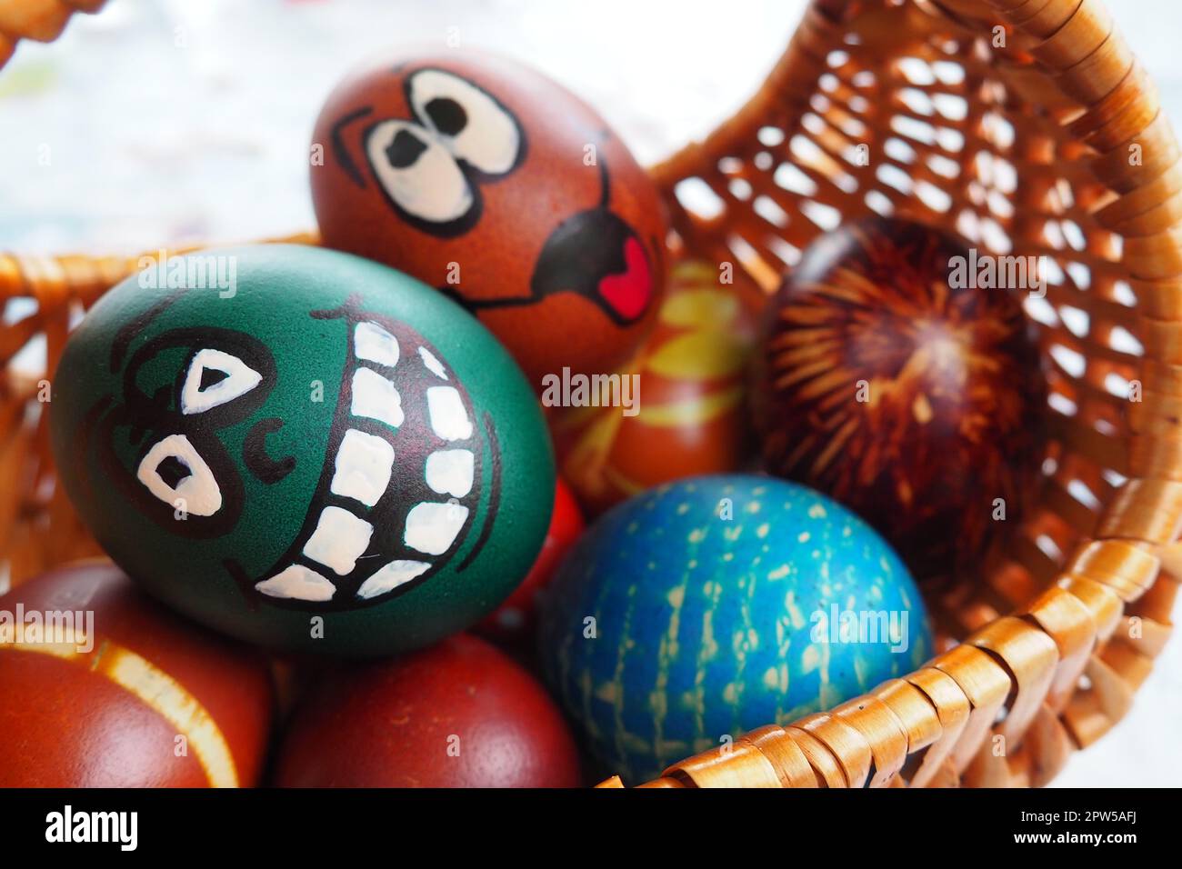 Easter eggs painted in different colors with painted laughing faces ...