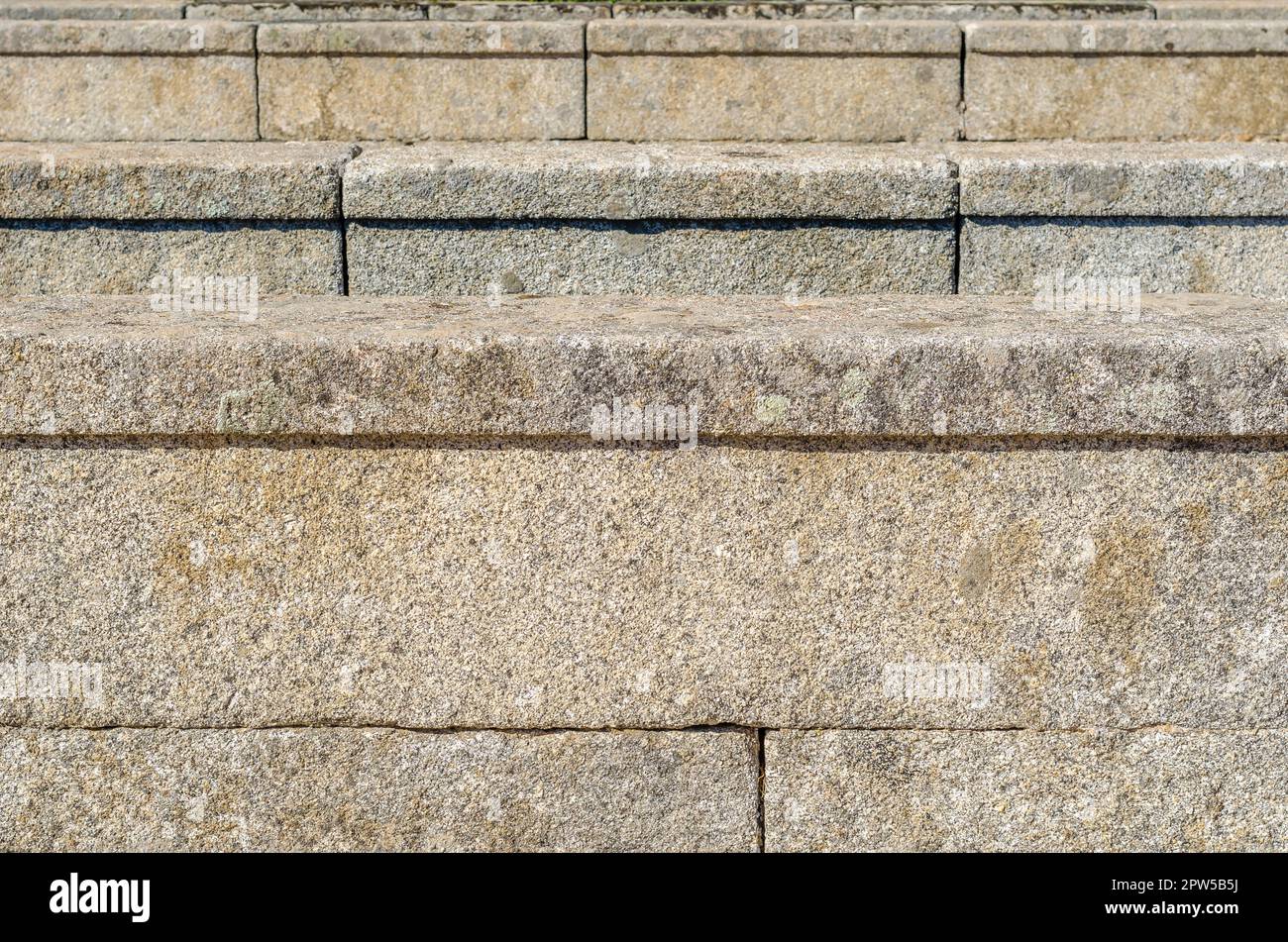 Rough stone wall detail, granite textured background Stock Photo - Alamy