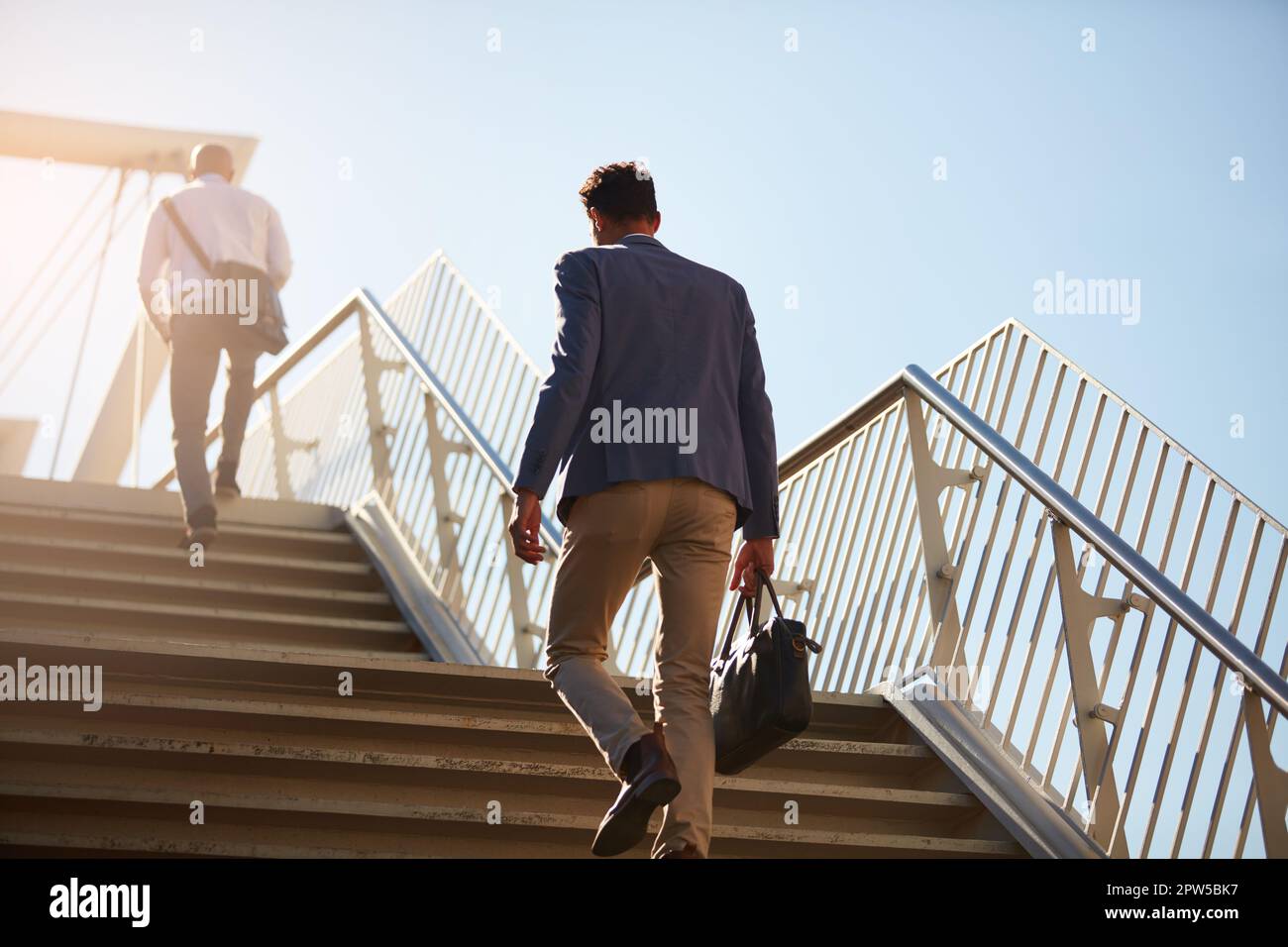 All on our way to the office. Low angle shot of unrecognizable ...