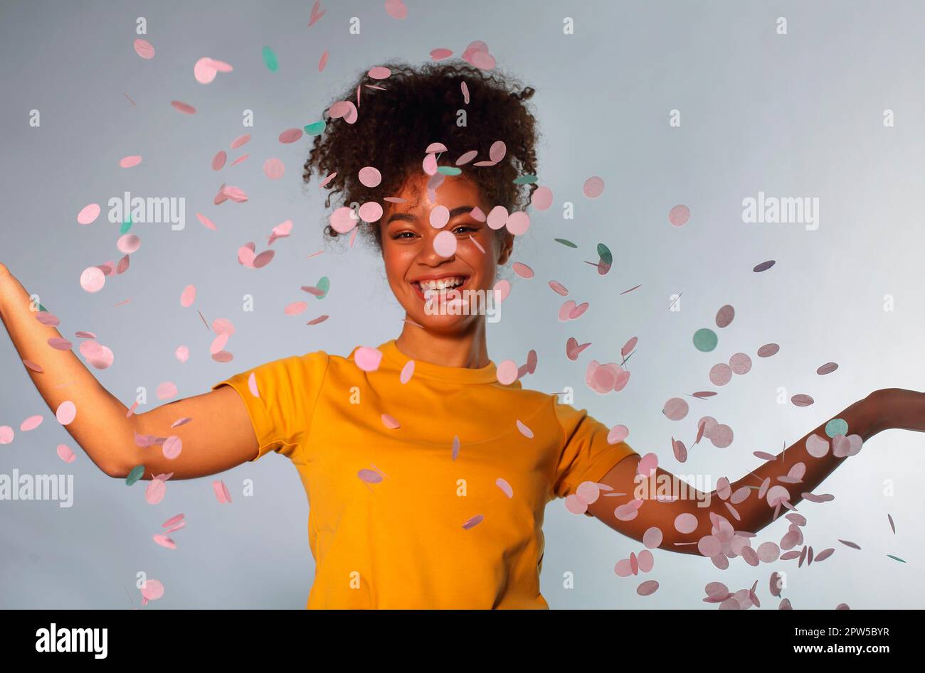 Girl throwing confetti hi-res stock photography and images - Alamy