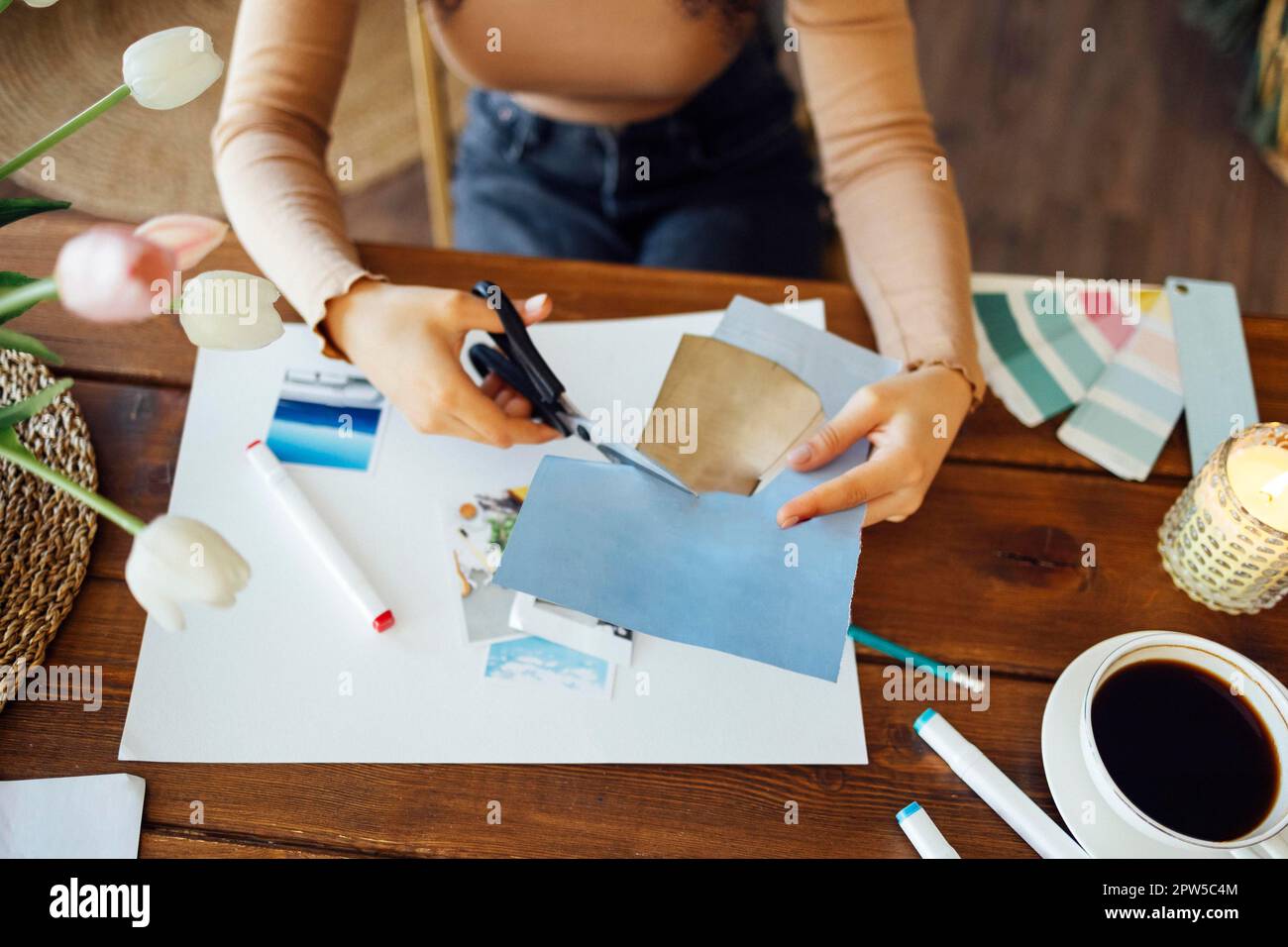 Young brunette african american woman creating her Feng Shui wish map ...