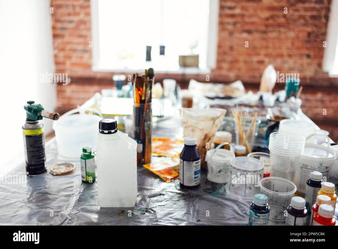 Modern interior of the art workshop or studio. Buckets with paint ...