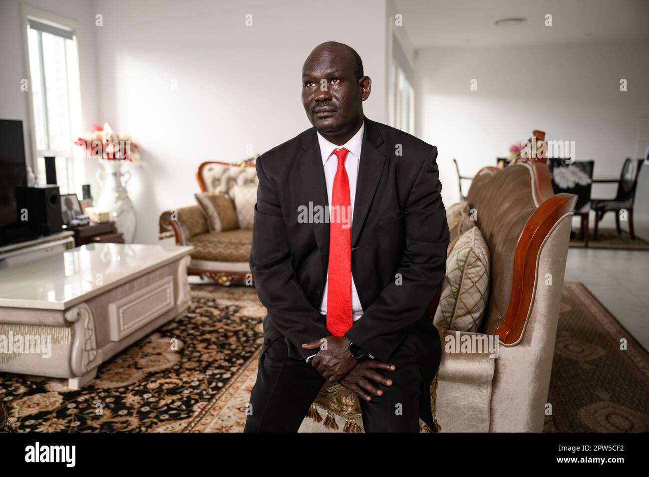 South Sudanese refugee Emmanuel Kondok poses for a photograph at his ...