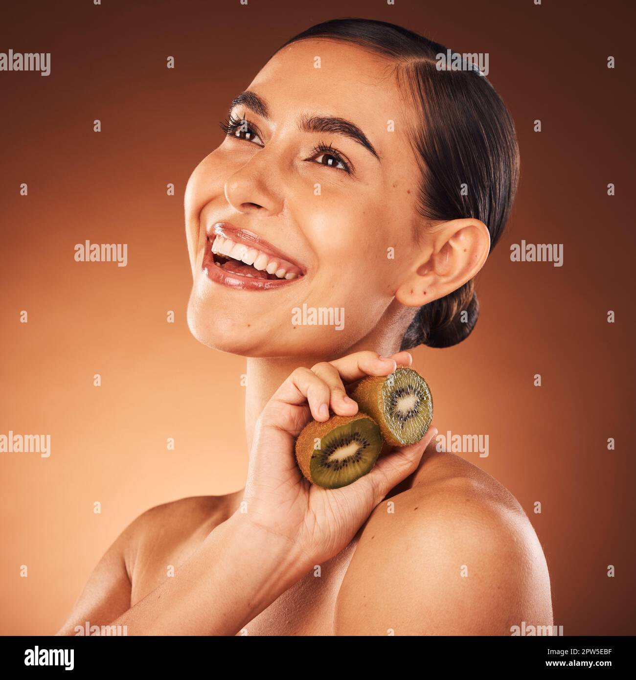Beauty, skincare and woman in studio with kiwi fruit or natural face ...