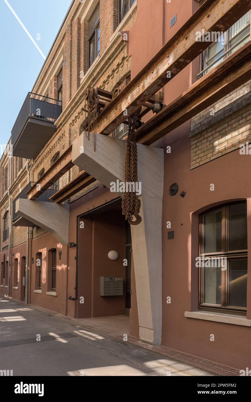 Restored entrance area of an old factory building Stock Photo - Alamy